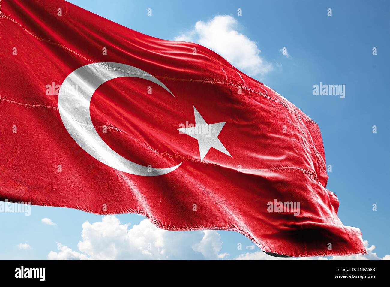 3d Illustration of Flag of Turkey waving in the wind against a blue sky ...