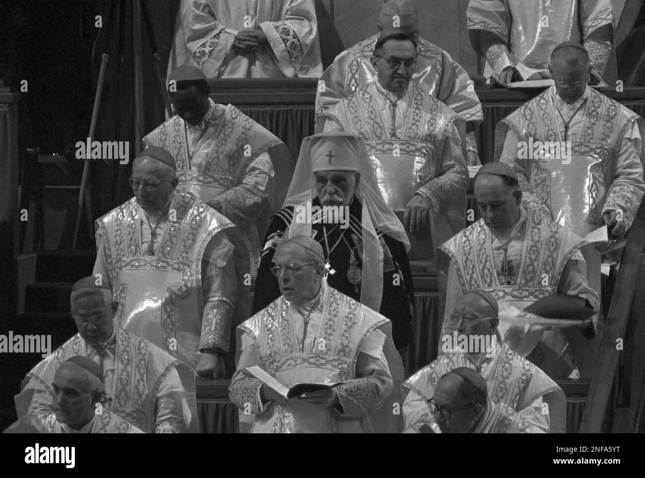 Cardinals stand in their benches in St. Peter's Basilica during the ...