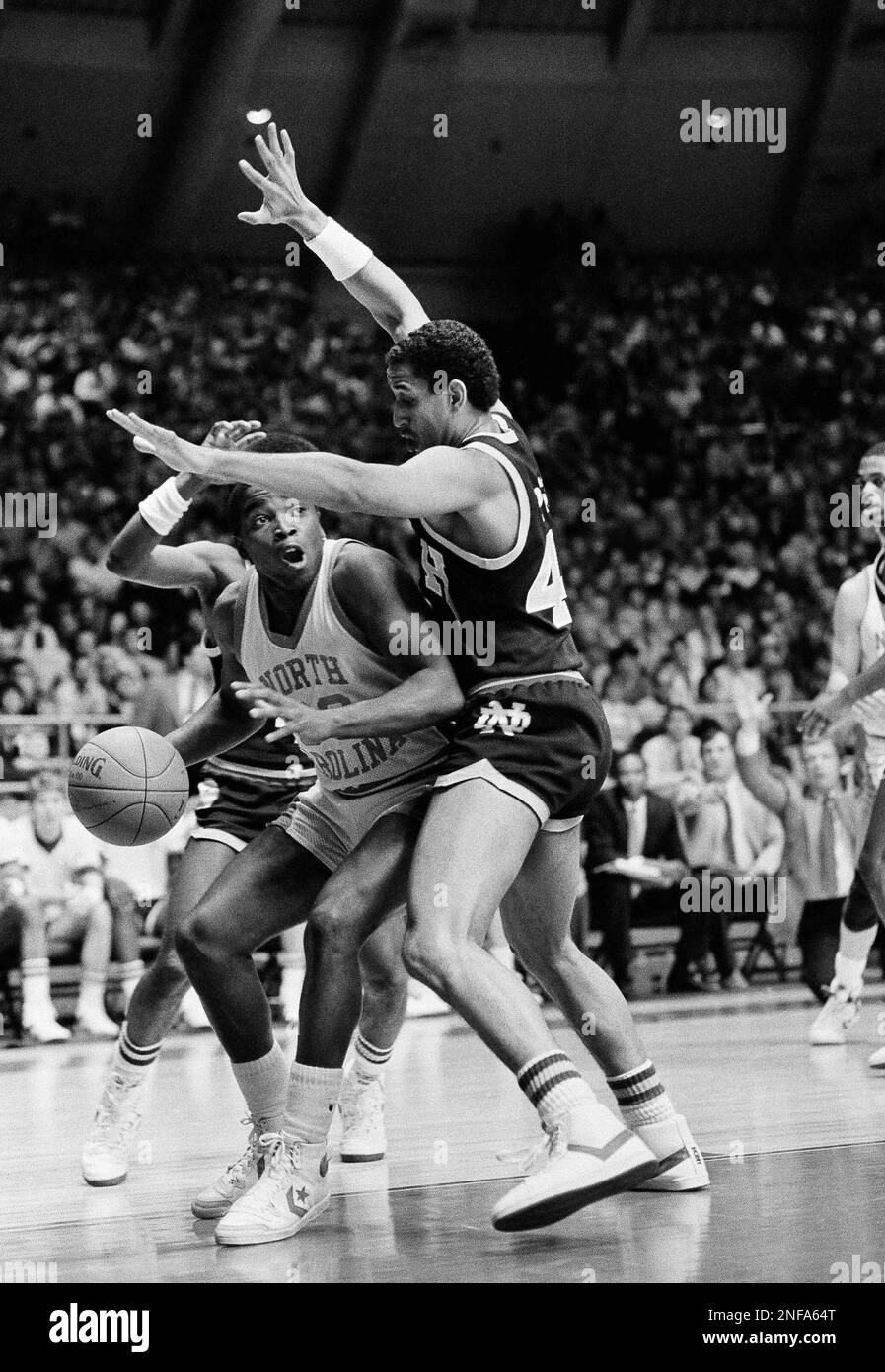 North Carolina’s Ranzino Smith drives by Notre Dame’s Joseph Price ...