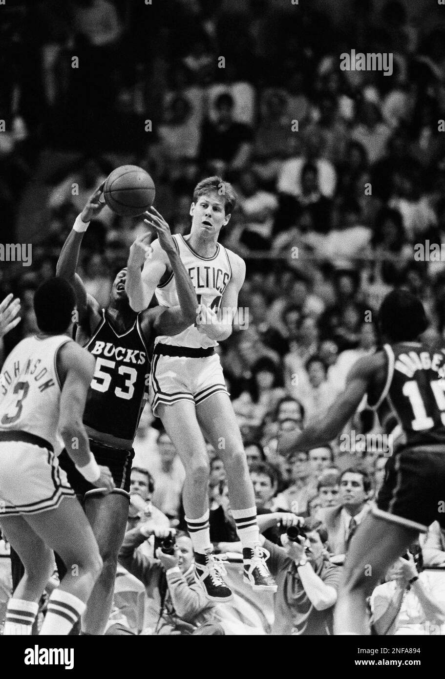 Danny Ainge of the Boston Celtics, right, flies into Alton Lister of ...