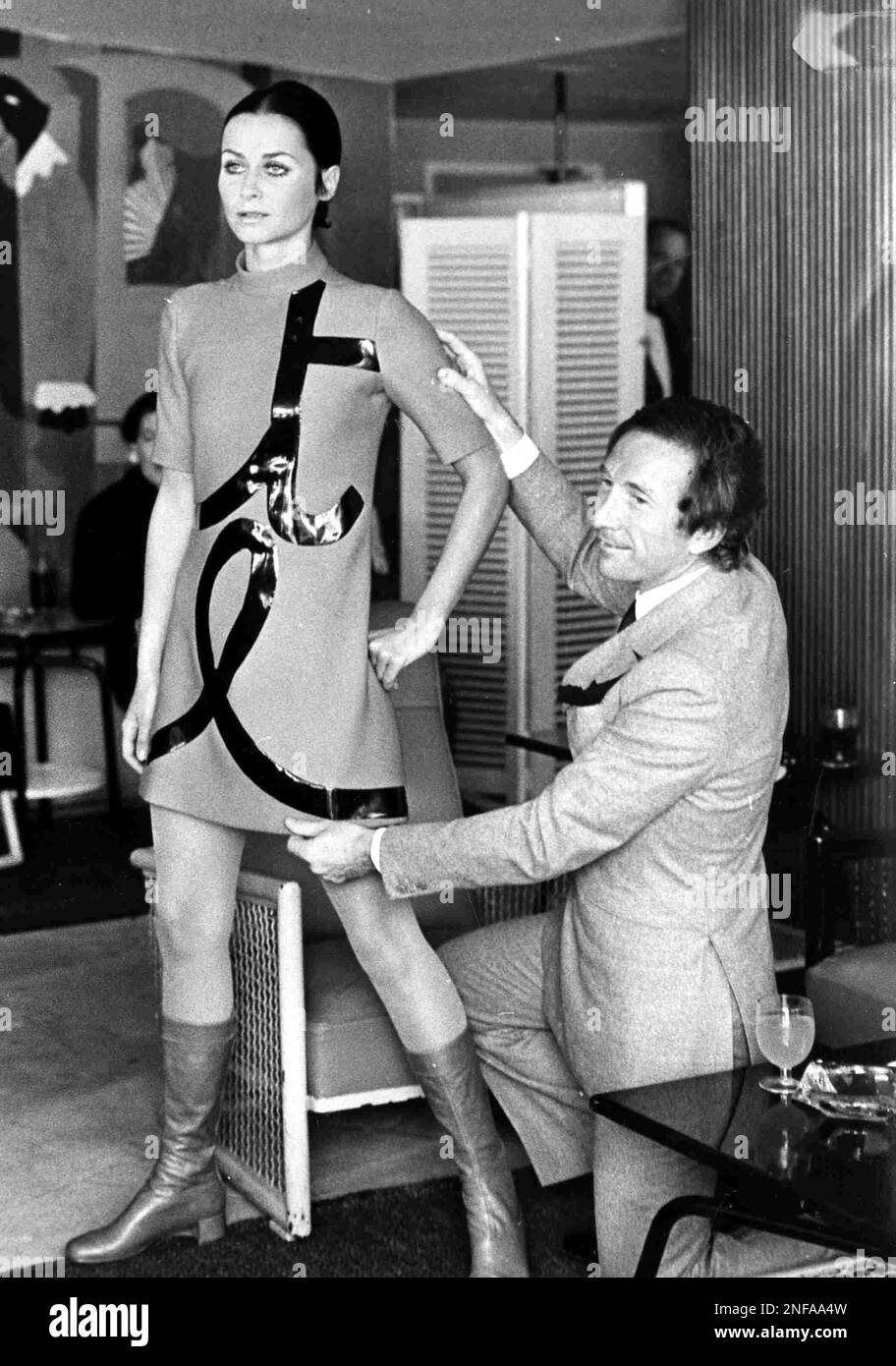 French fashion designer Ted Lapidus with a model from his 1969-1970 ...