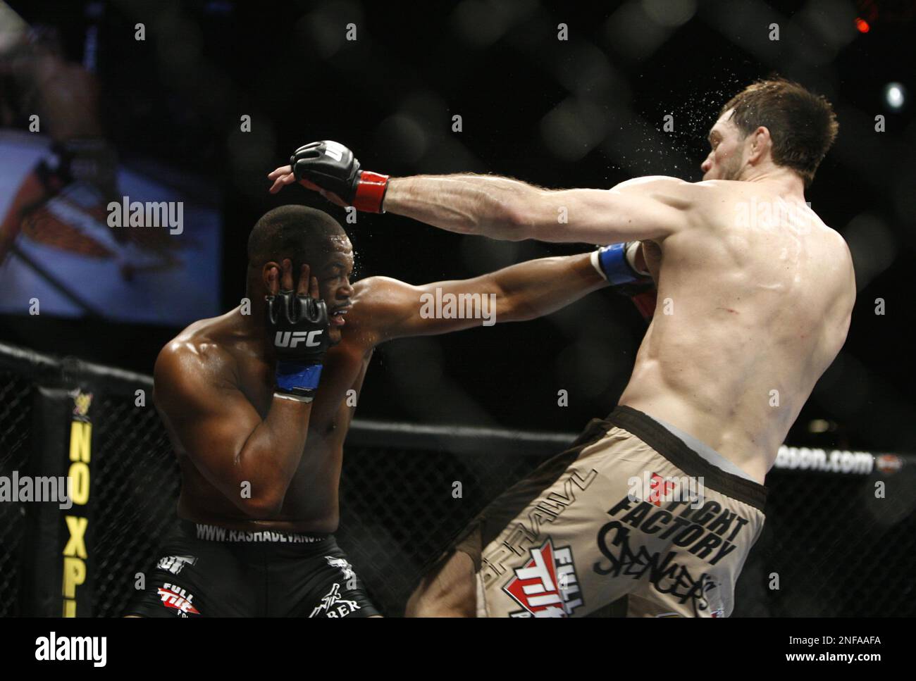 Rashad Evans, left, fights Forrest Griffin during their UFC light ...
