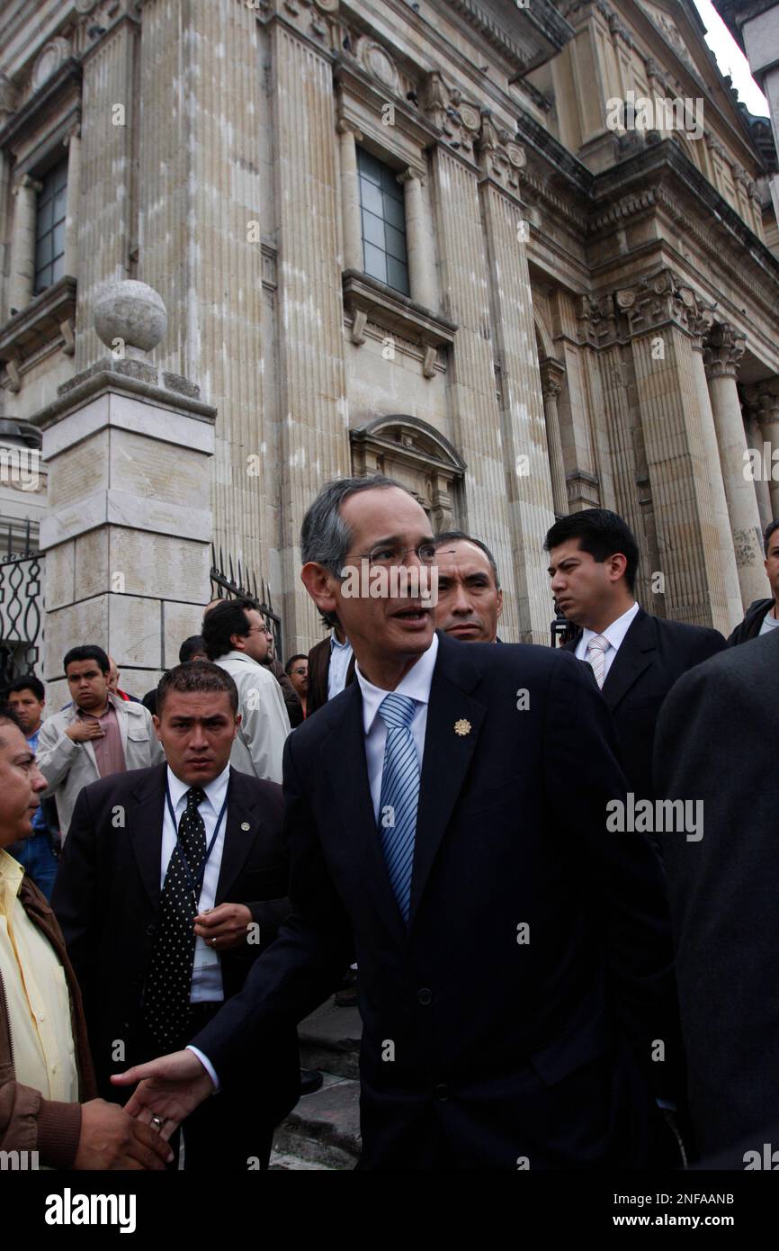Guatemala's President Alvaro Colom walks after attending a mass to ...