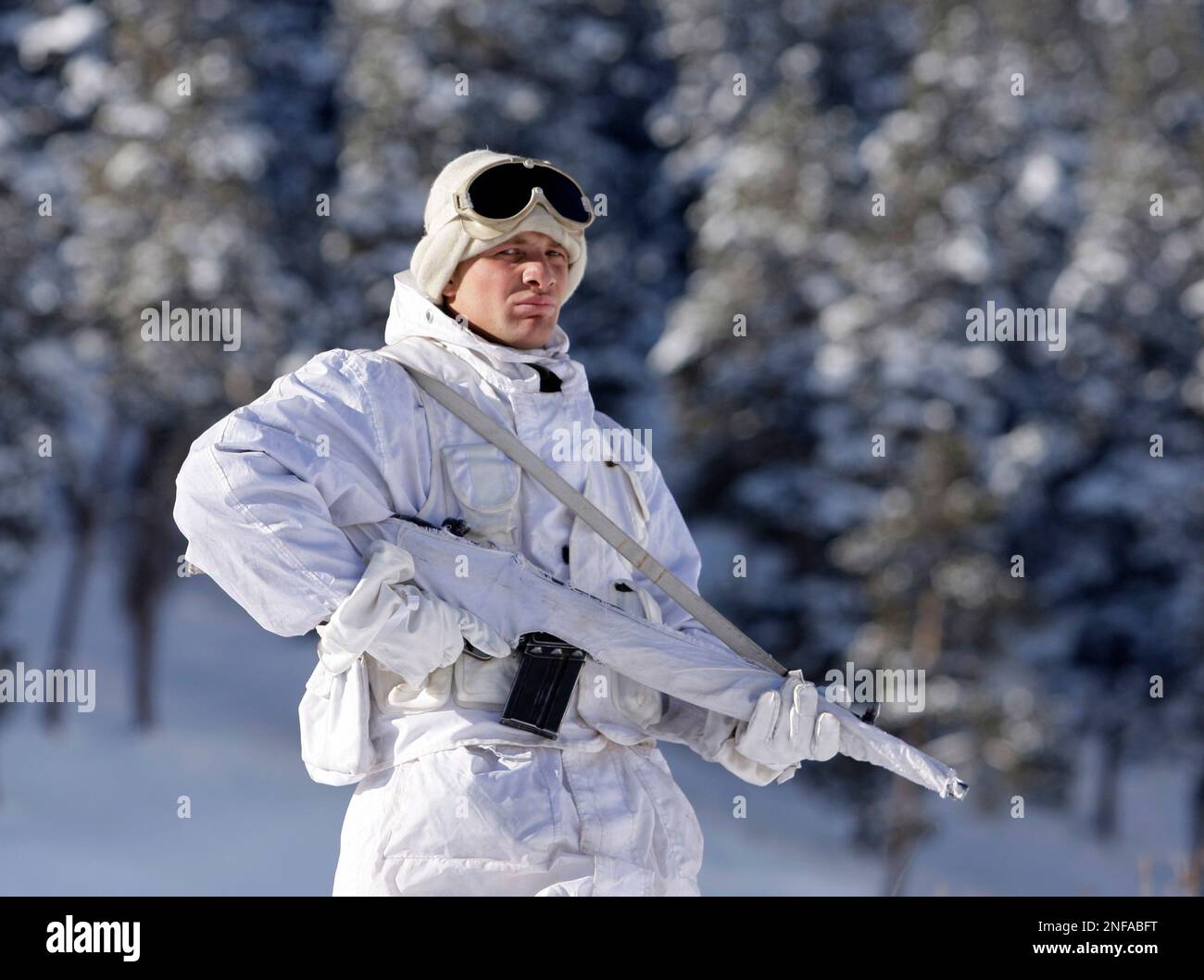 A Turkish commando stands guard in the mountains near the town of ...