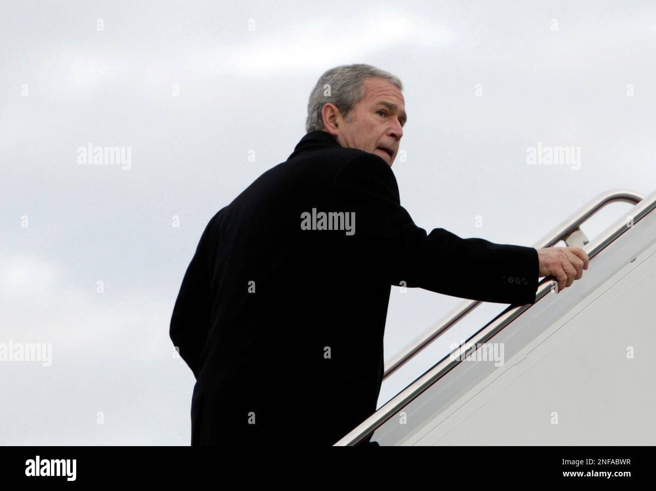 President George W. Bush walks up the stairs to Air Force One on Friday ...