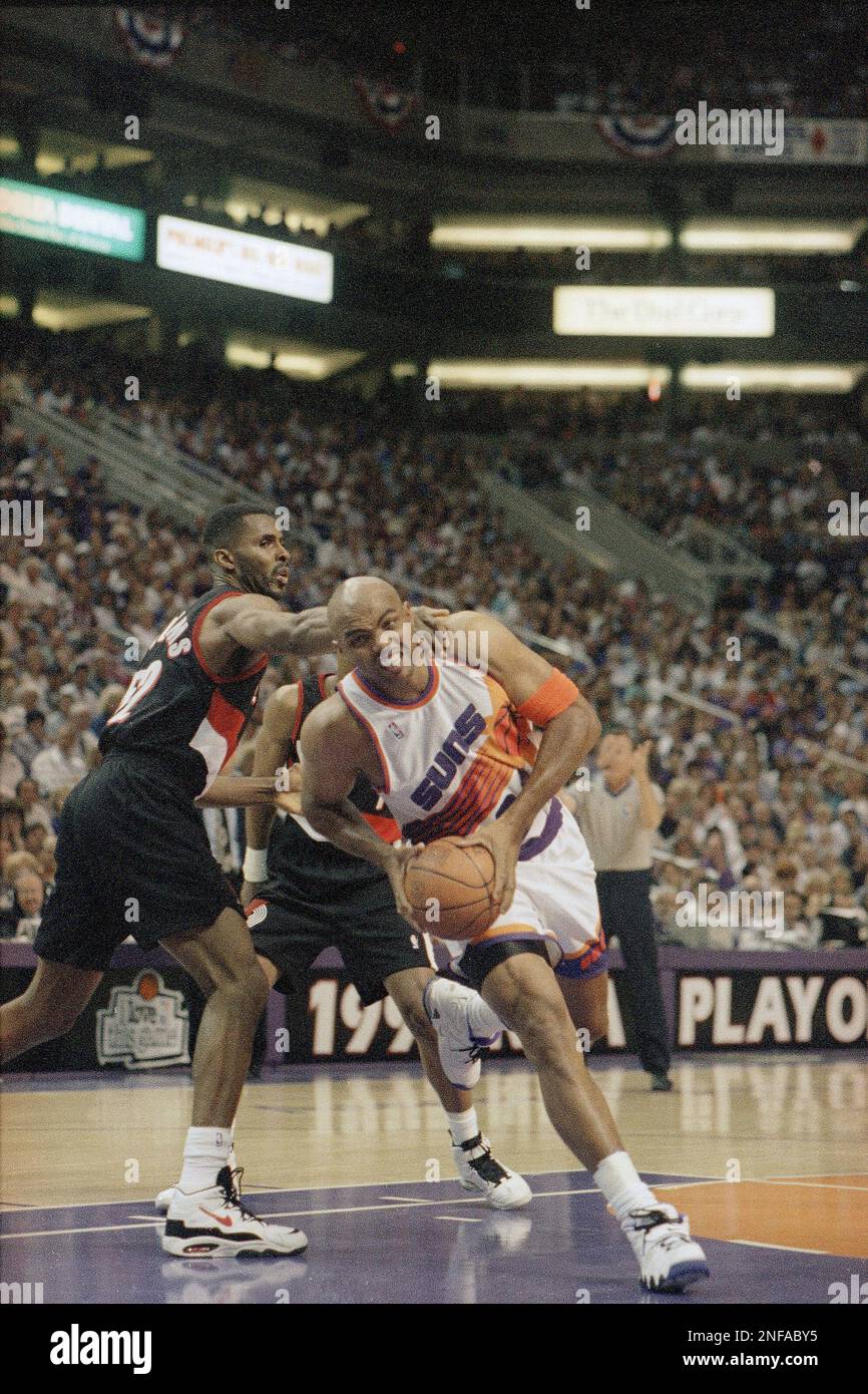 Portland Trail Blazers forward Buck Williams, left, grabs hold of ...