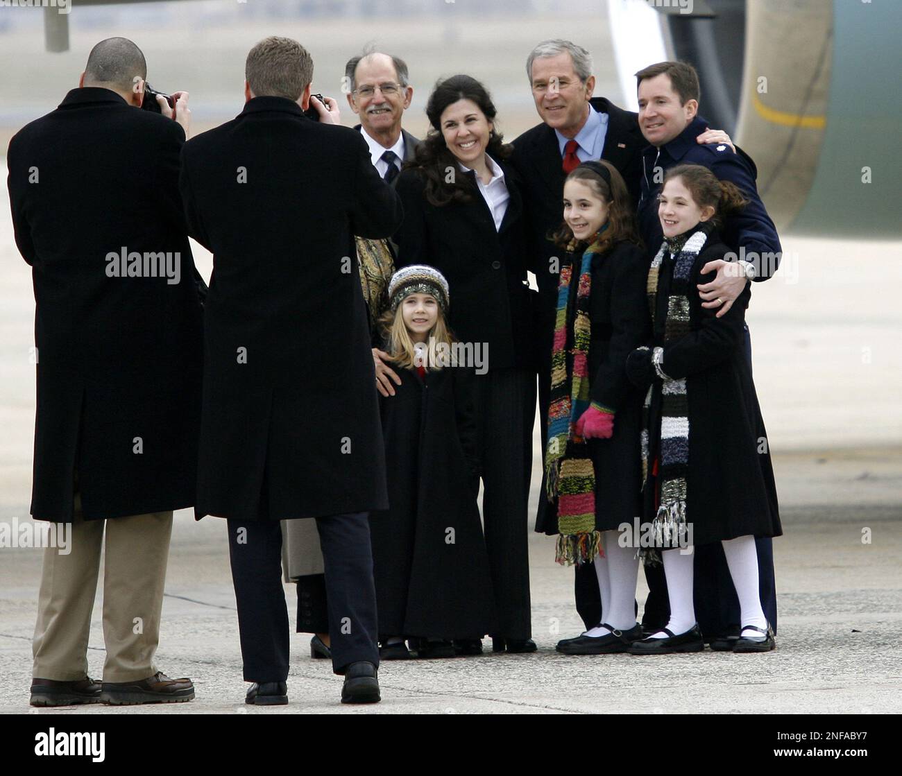 President George W. Bush poses with Denio and Donna Alvarado and their ...