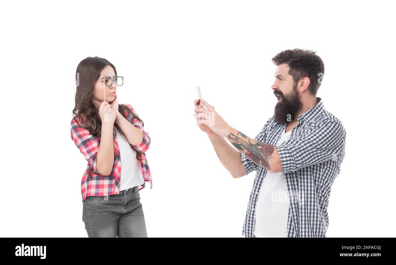 Create fun with paper accessory. Happy family fun. Girl child with ...