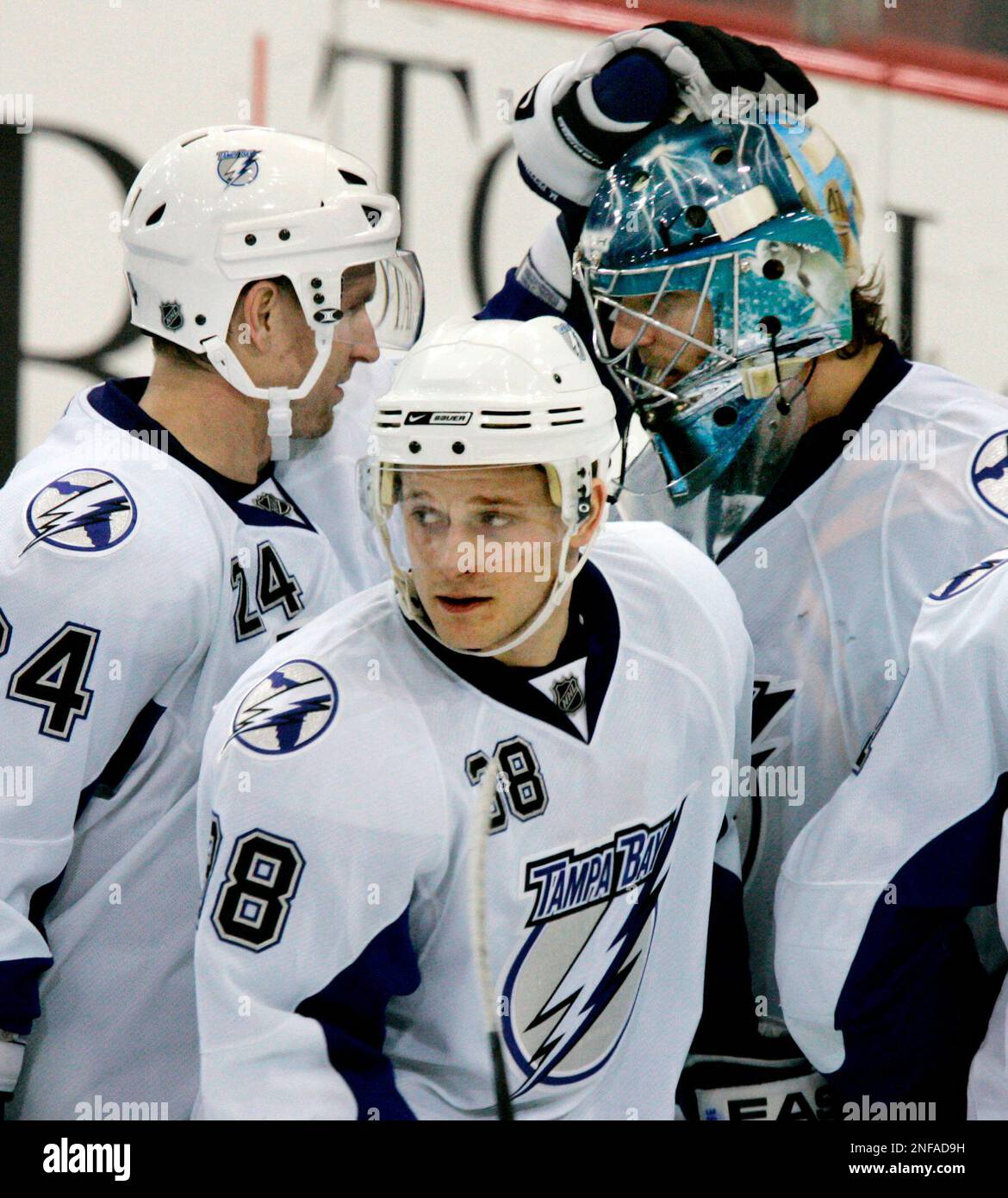 Tampa Bay Lightning goalie Mike Smith, right, is congratulated by ...