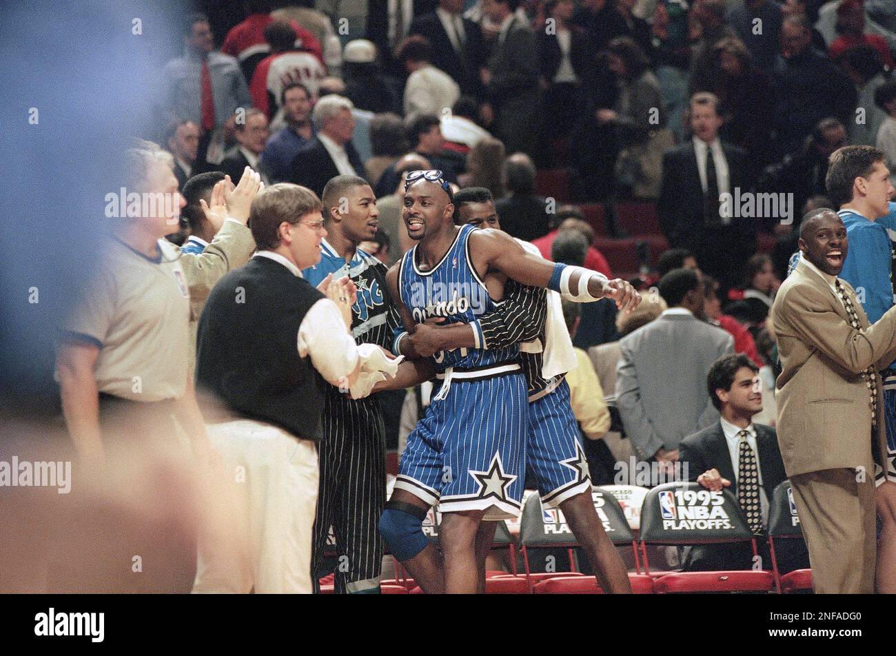 Orlando Magic’s Horace Grant is hugged by teammate Anthony Bowie after ...