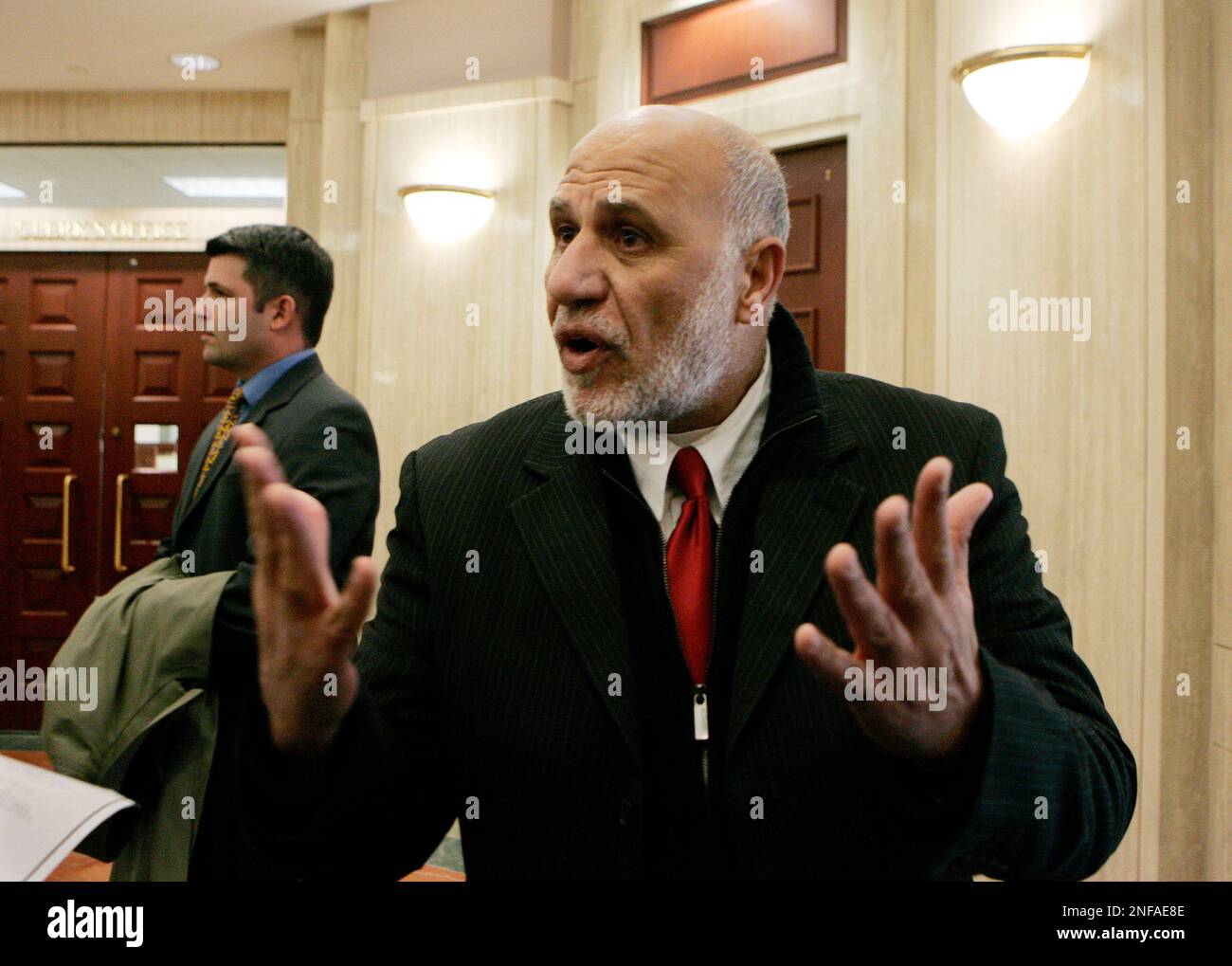 Mohamad Ibrahim Shnewer reacts in a court hall after his son, Mohamad ...