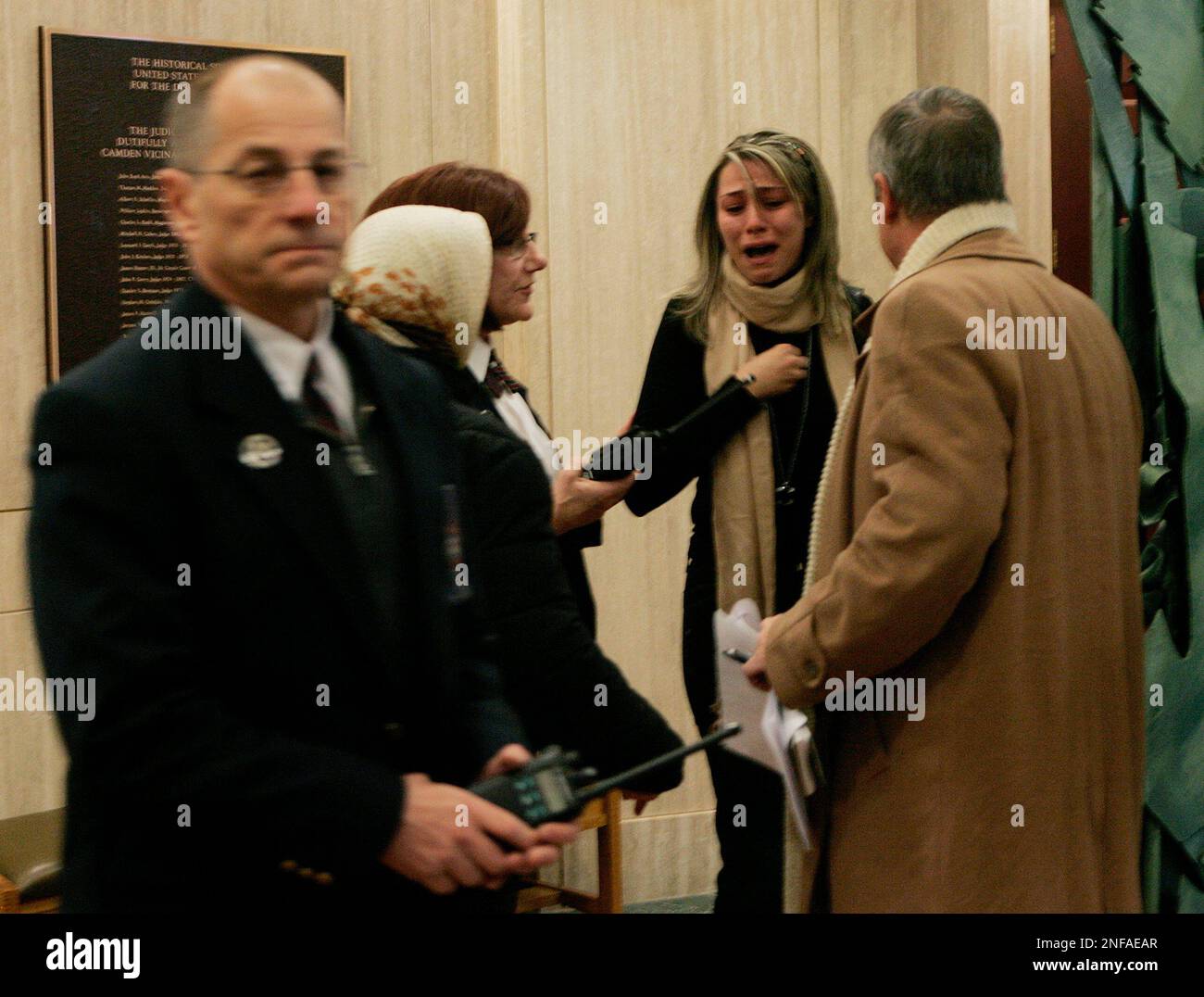 Serpil Tatar reacts in a court hall after her brother, Serdar Tatar, a ...