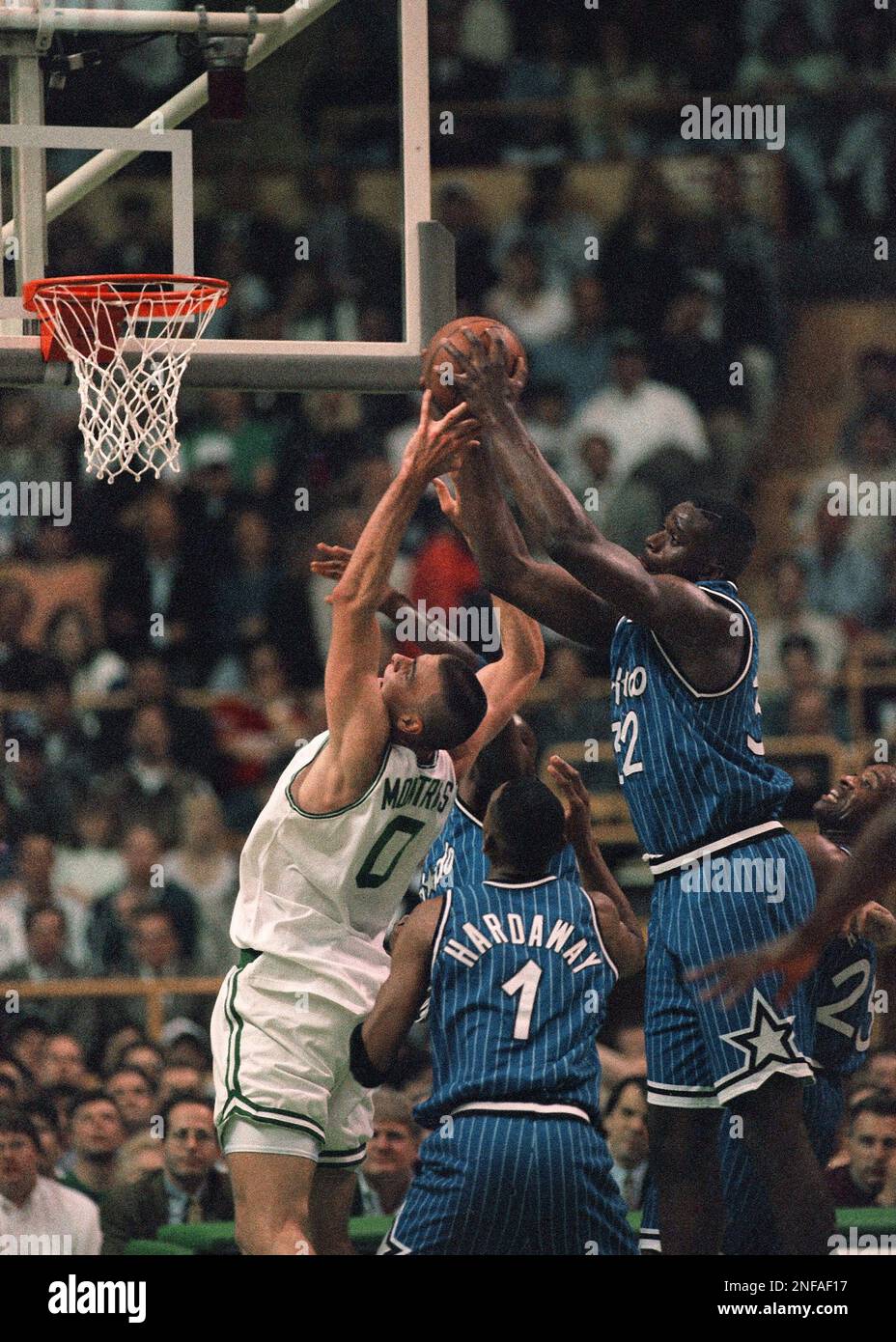 Orlando Magic center Shaquille O'Neal, right, reaches over Boston ...