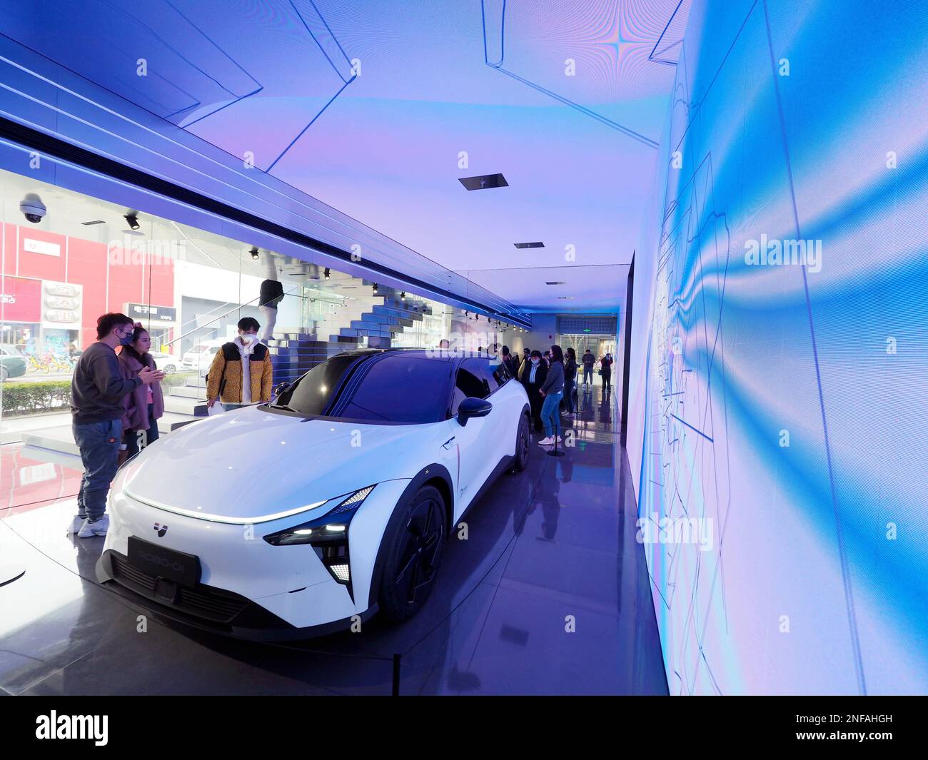 BEIJING, CHINA - FEBRUARY 17, 2023 - Visitors view the ROBO-01 Moon Exploration car robot, JIDU ...
