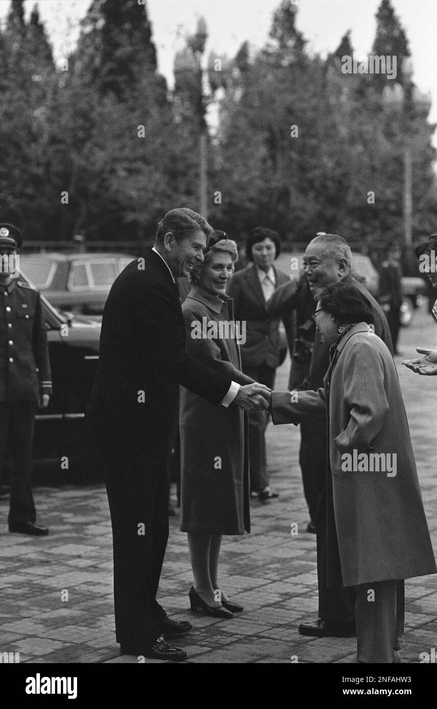 President Ronald Reagan is welcomed to Peking by Lin Jiamei, the wife ...