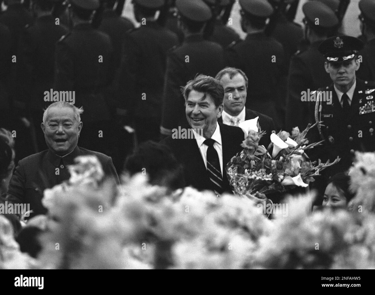 Chinese President Li Xiannian and President Ronald Reagan greet well ...