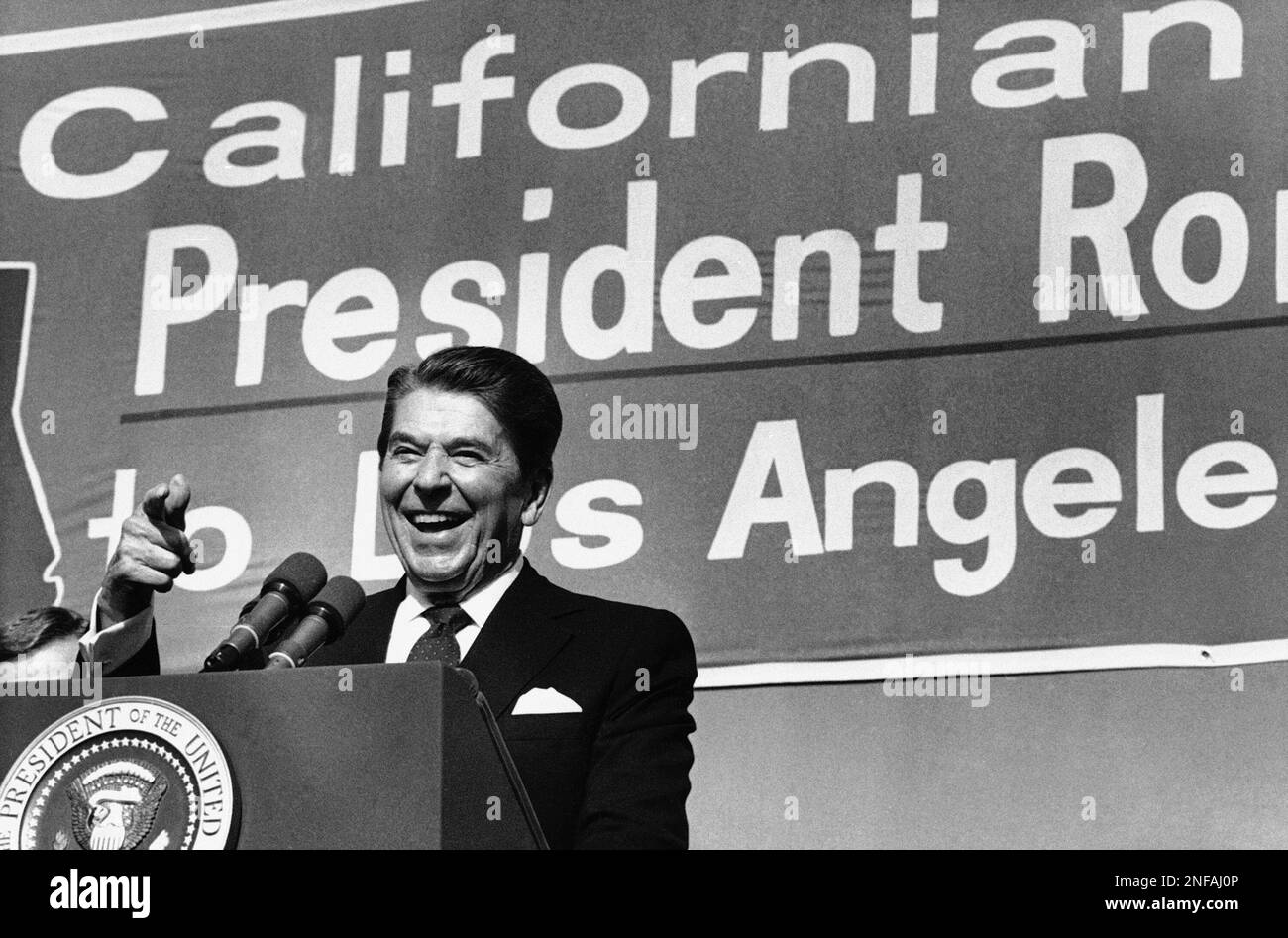 President Ronald Reagan points toward the crowd as he speaks during the ...