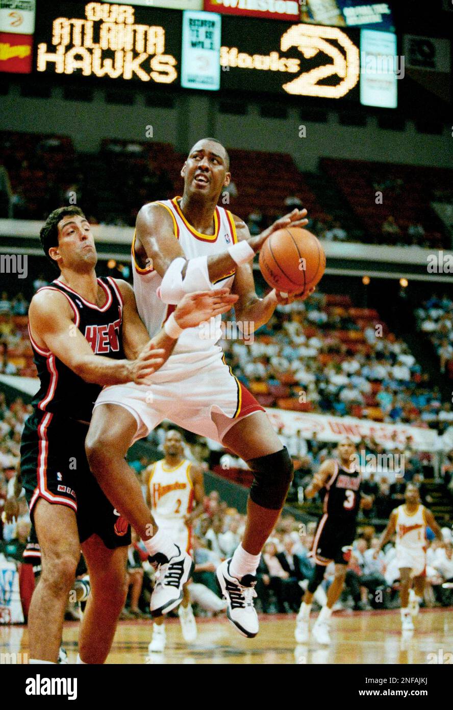 Atlanta Hawks forward Danny Manning (5) banks off Miami Heat Center Rony Saikaly in first half ...