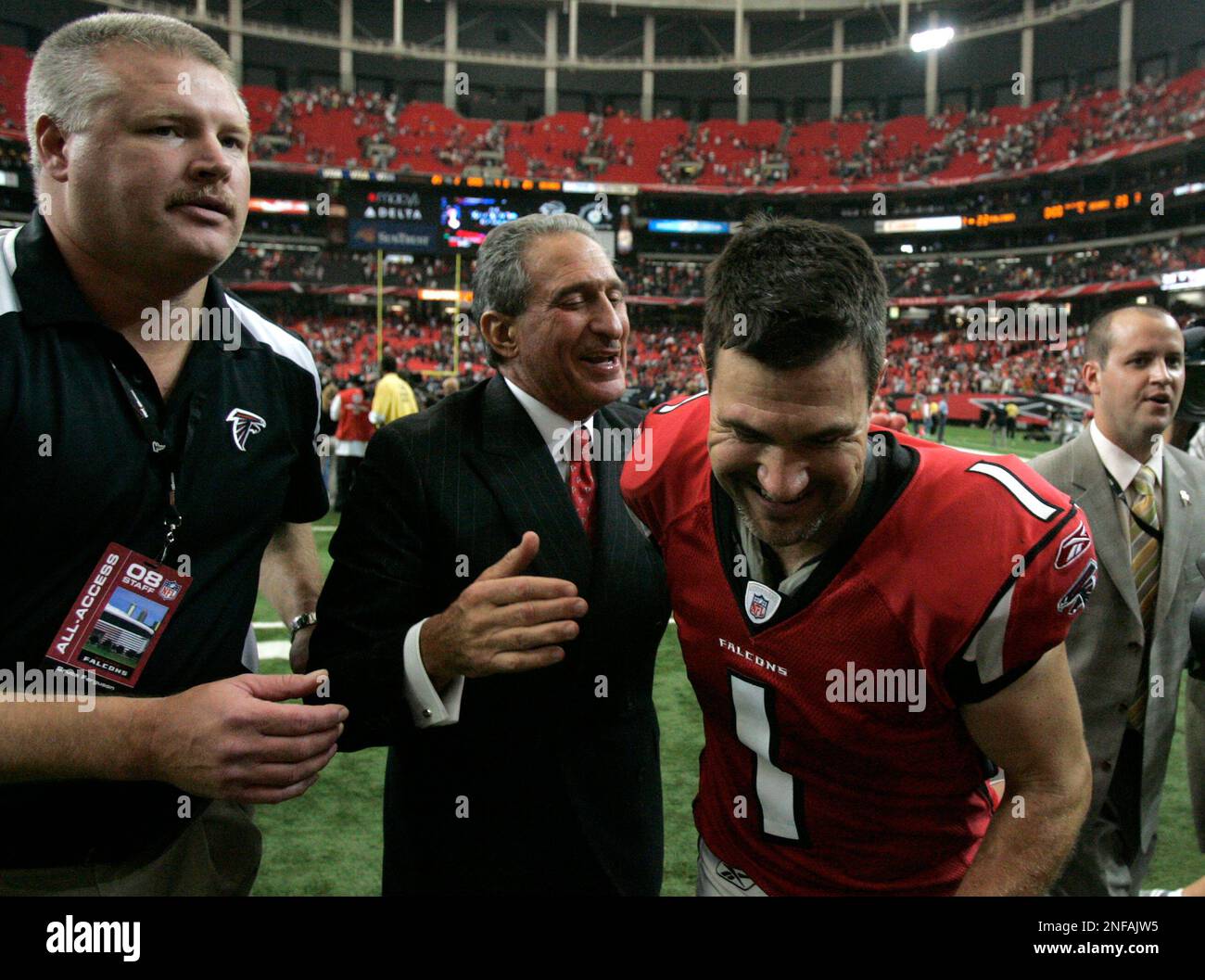 Atlanta Falcons Jason Elam #1 hugs Falcons owner Arthur Blank after ...