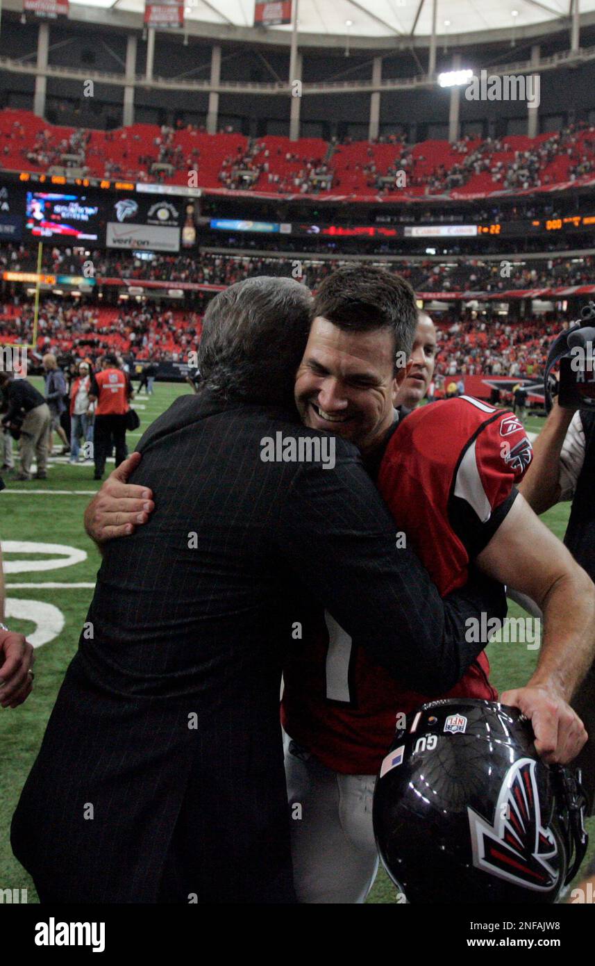 Atlanta Falcons Jason Elam #1 hugs Falcons owner Arthur Blank after ...