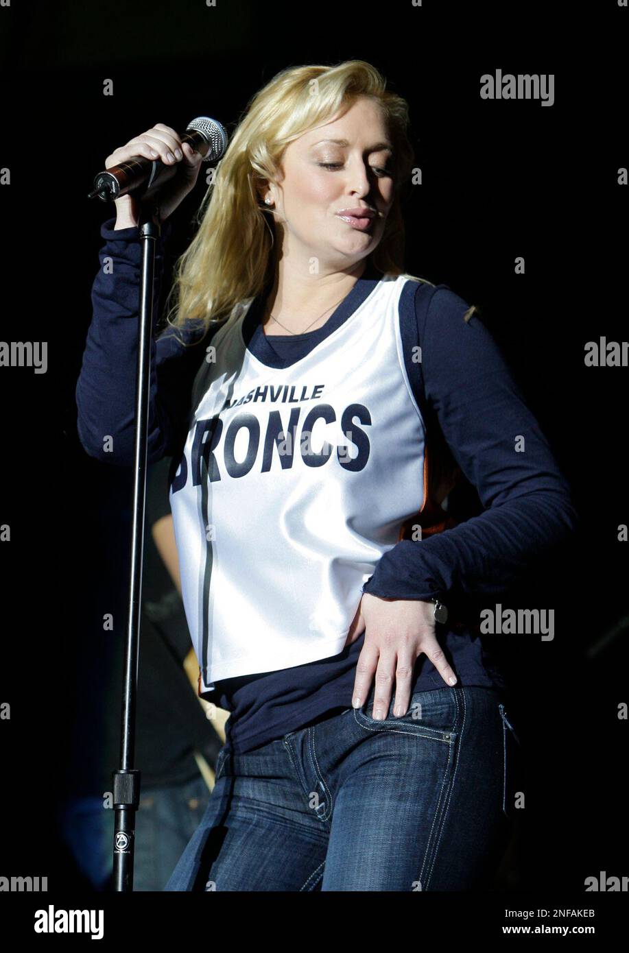 Country singer Mindy McCready waves to the crowd as she is introduced ...
