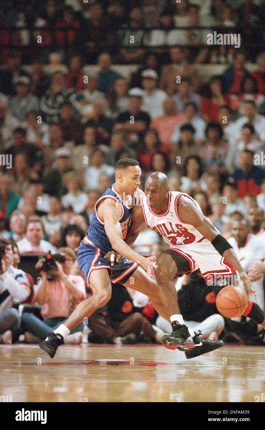Chicago Bulls Michael Jordan, right, drives on New York Knicks John ...