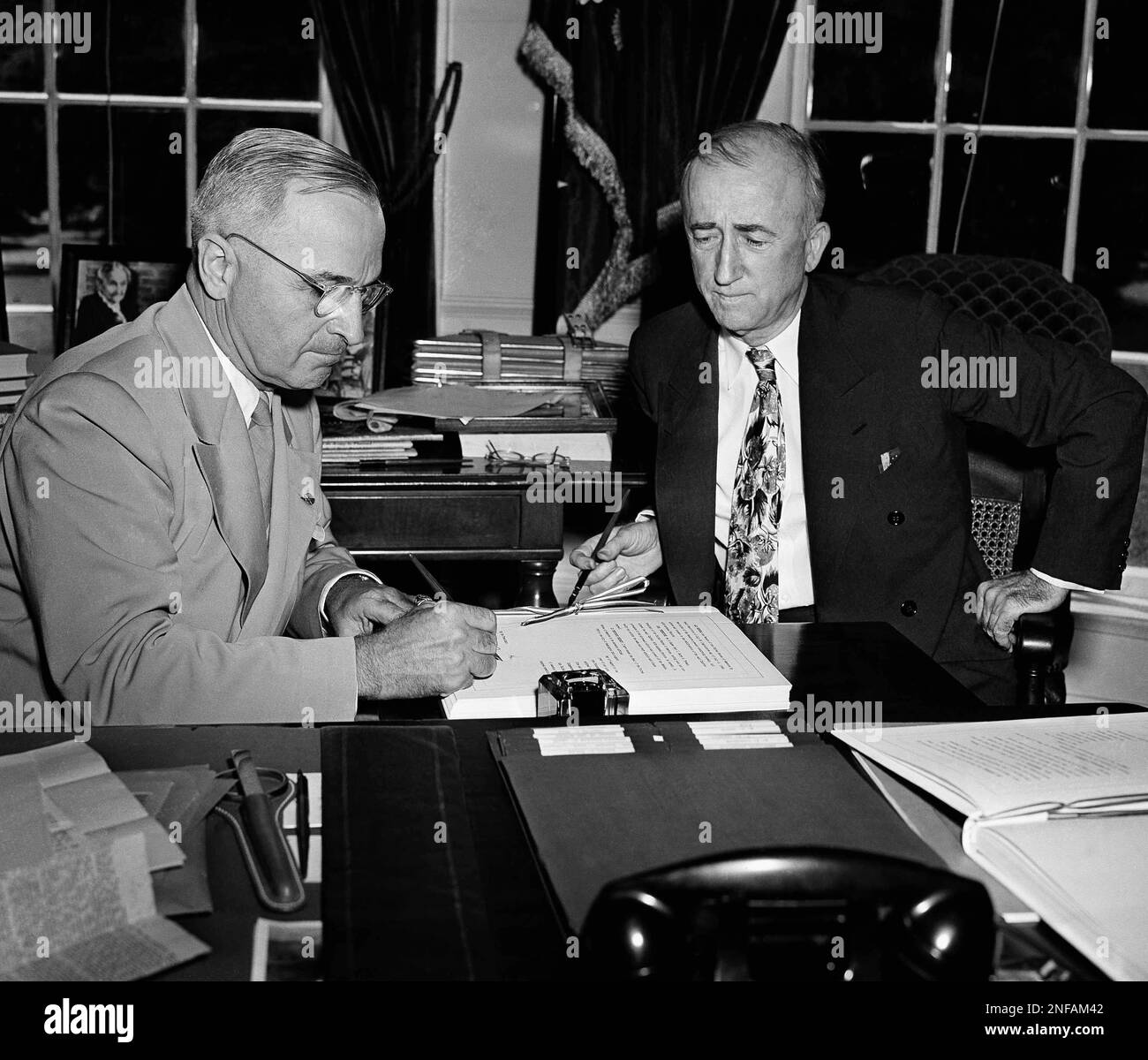 President Harry S. Truman signs the United Nations charter in ...