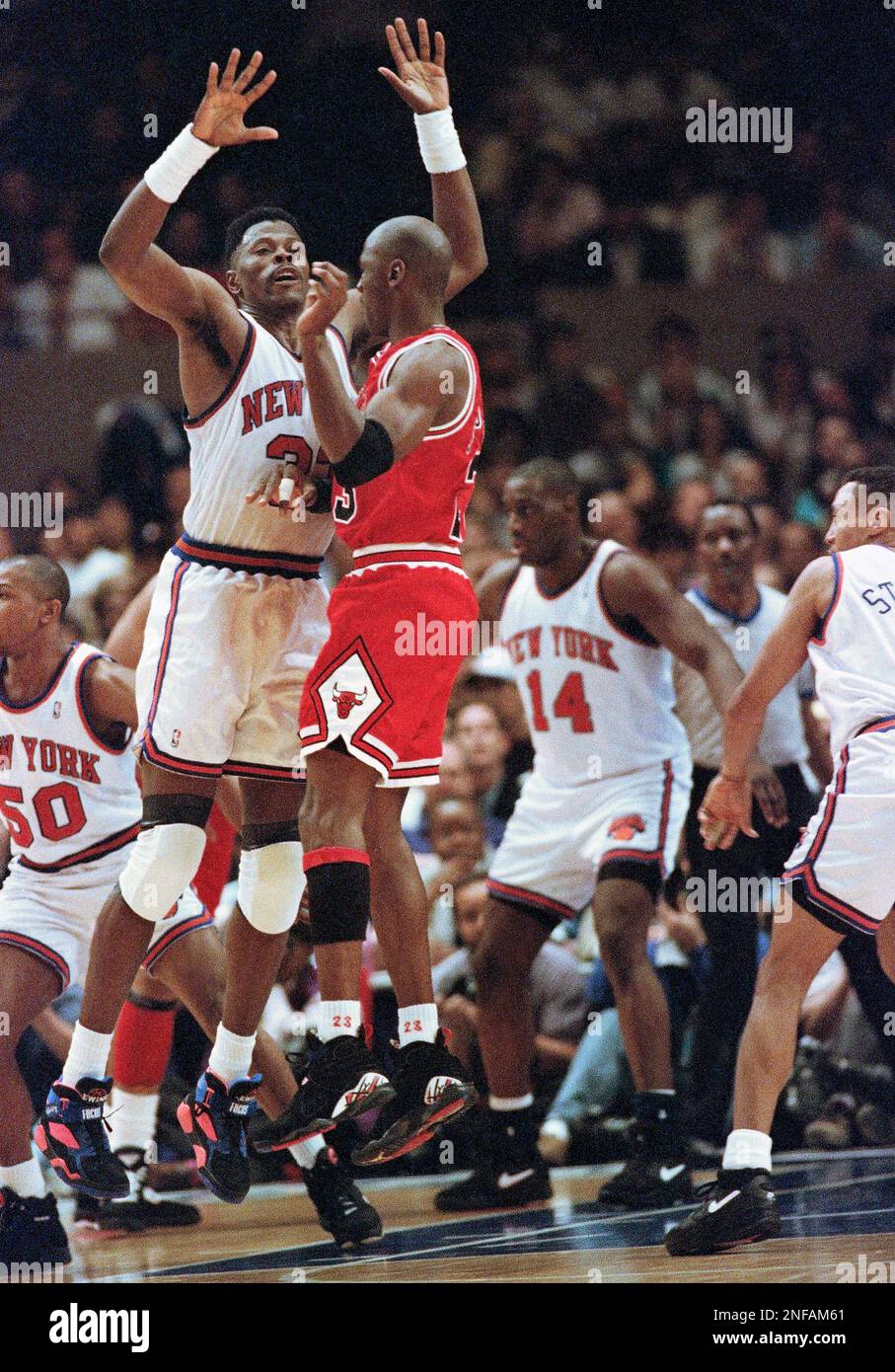 New York Knicks Patrick Ewing, left, guards Chicago Bulls Michael ...