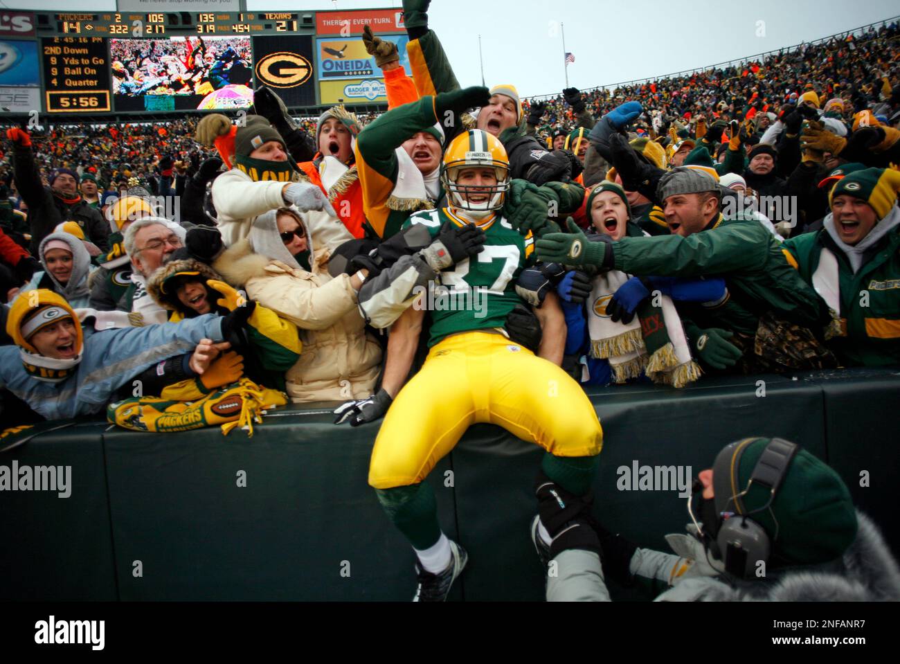 Green Bay Packers Jordy Nelson #87 performs a Lambeau Leap after a touchdown against the Houston ...