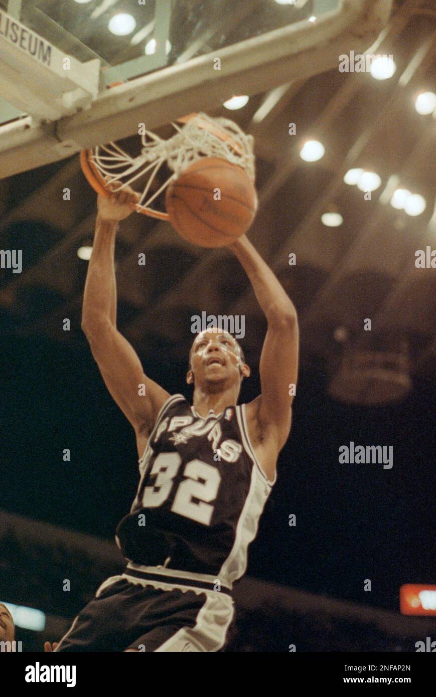 Sean Elliott of the San Antonio Spurs slams for two points during first ...
