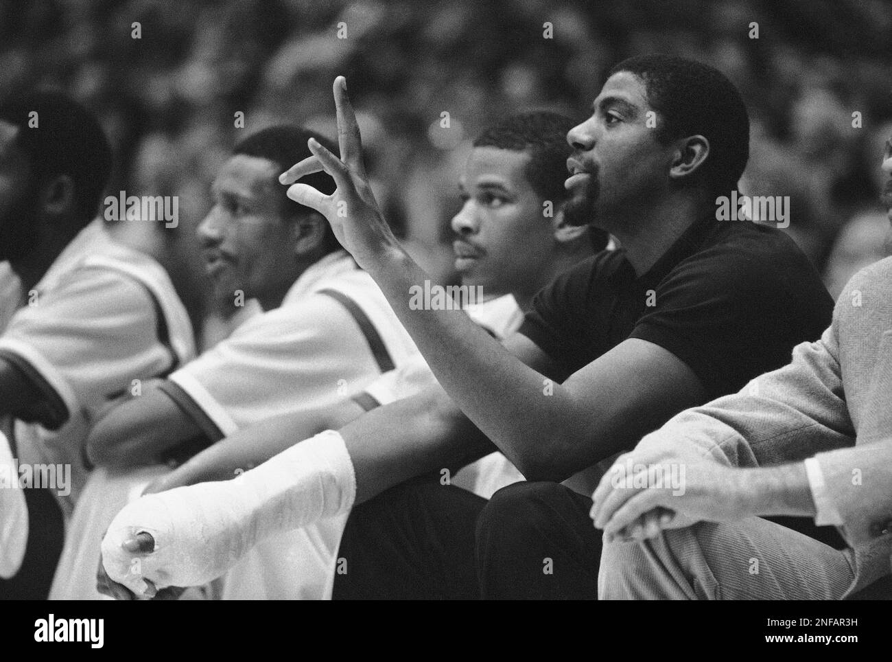 Los Angeles Lakers guard Earvin "Magic" Johnson gestures from the bench ...