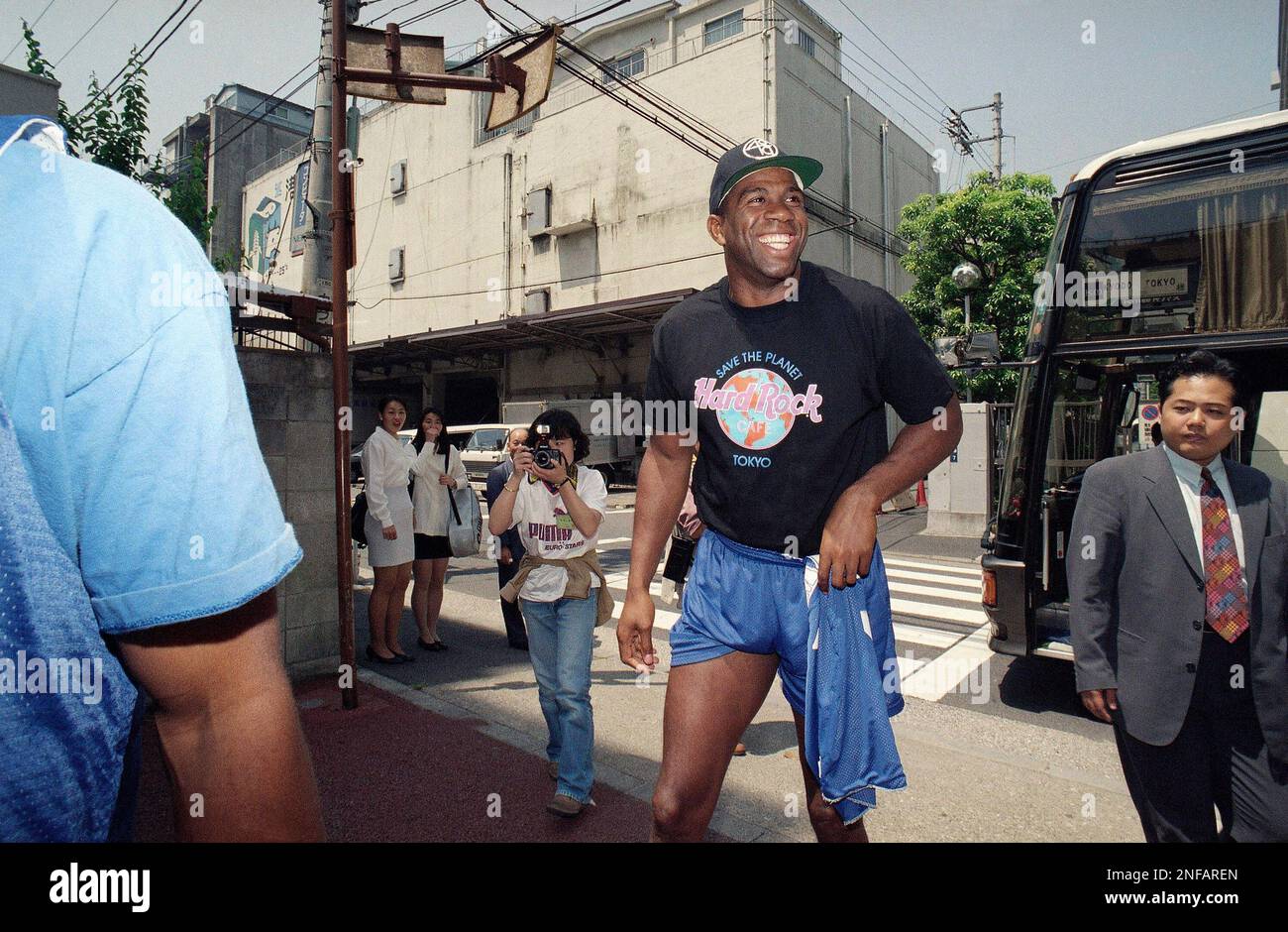 Former Los Angeles Laker Earvin "Magic" Johnson flashes his familiar ...