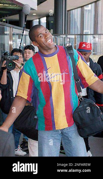 Former NBA superstar Magic Johnson smiles upon arrival at the new Tokyo ...