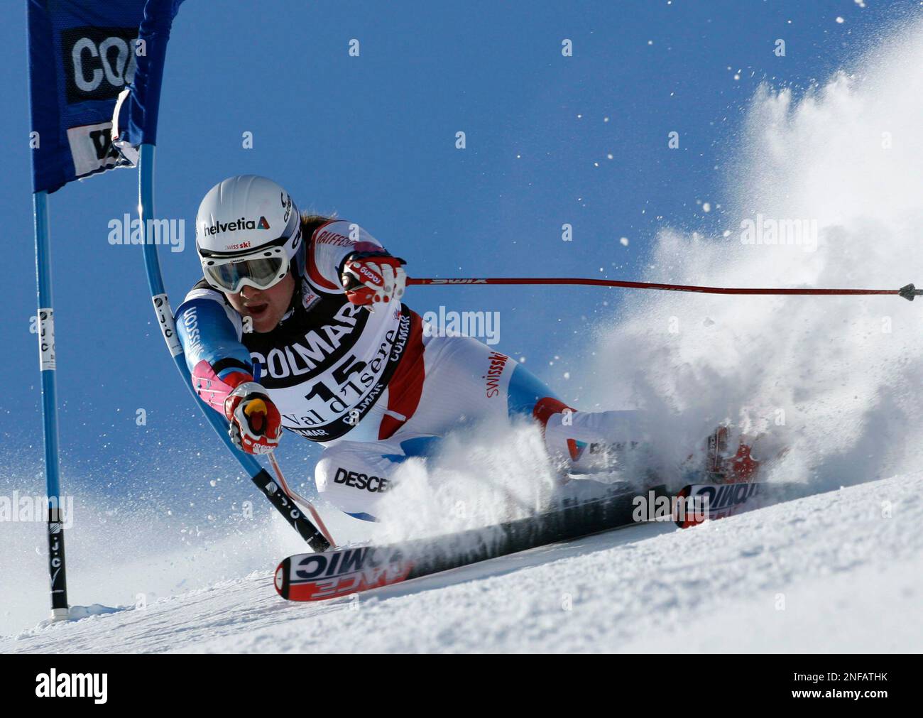 Marc Berthod, of Switzerland, powers past a gate during the first run ...