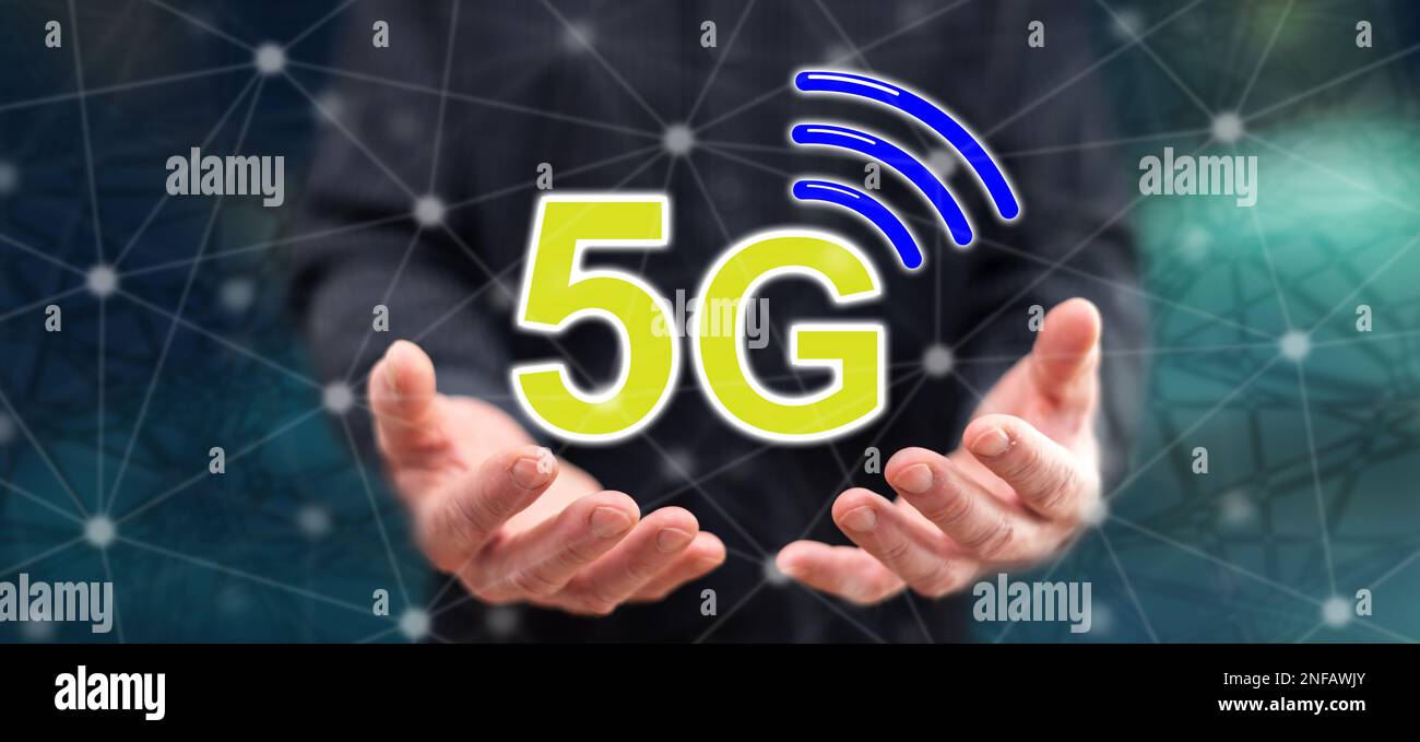 5g concept above the hands of a man in background Stock Photo - Alamy