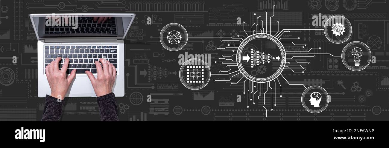 Top view of hands using laptop with symbol of deep learning concept ...