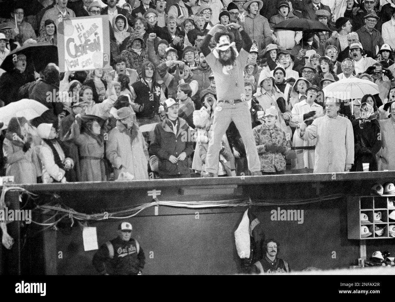 "Wild Bill" Hagy, a taxi driver, stands atop the Orioles dugout to lead ...