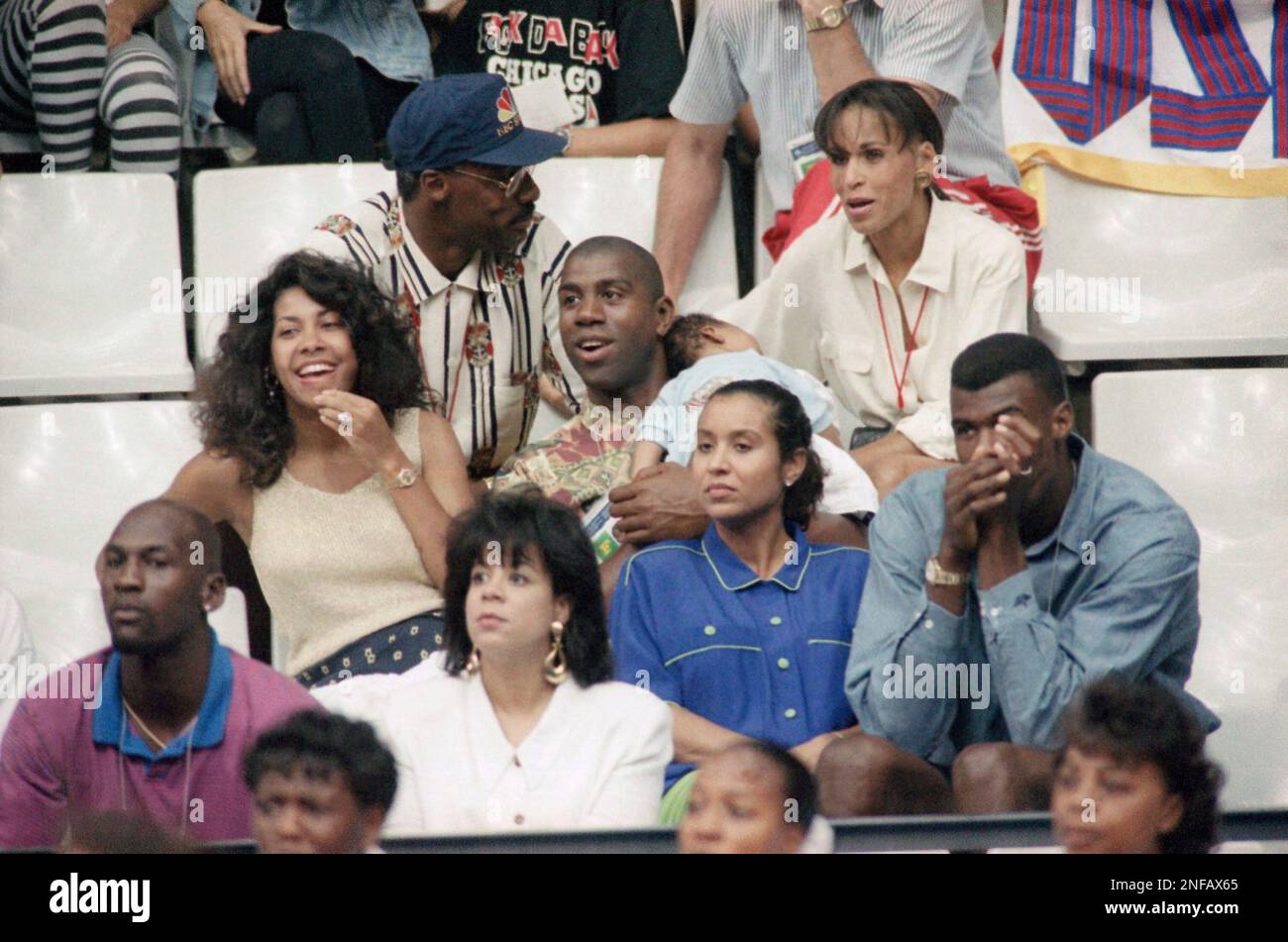 Earvin Johnson, center, his wife Cookie, left, and baby Earvin Johnson ...