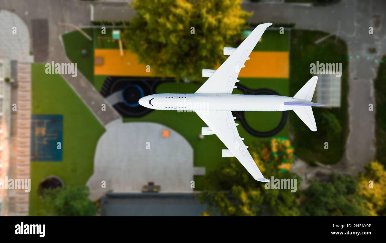 plane flies above the landscape. Side view of aircraft. Travel and ...