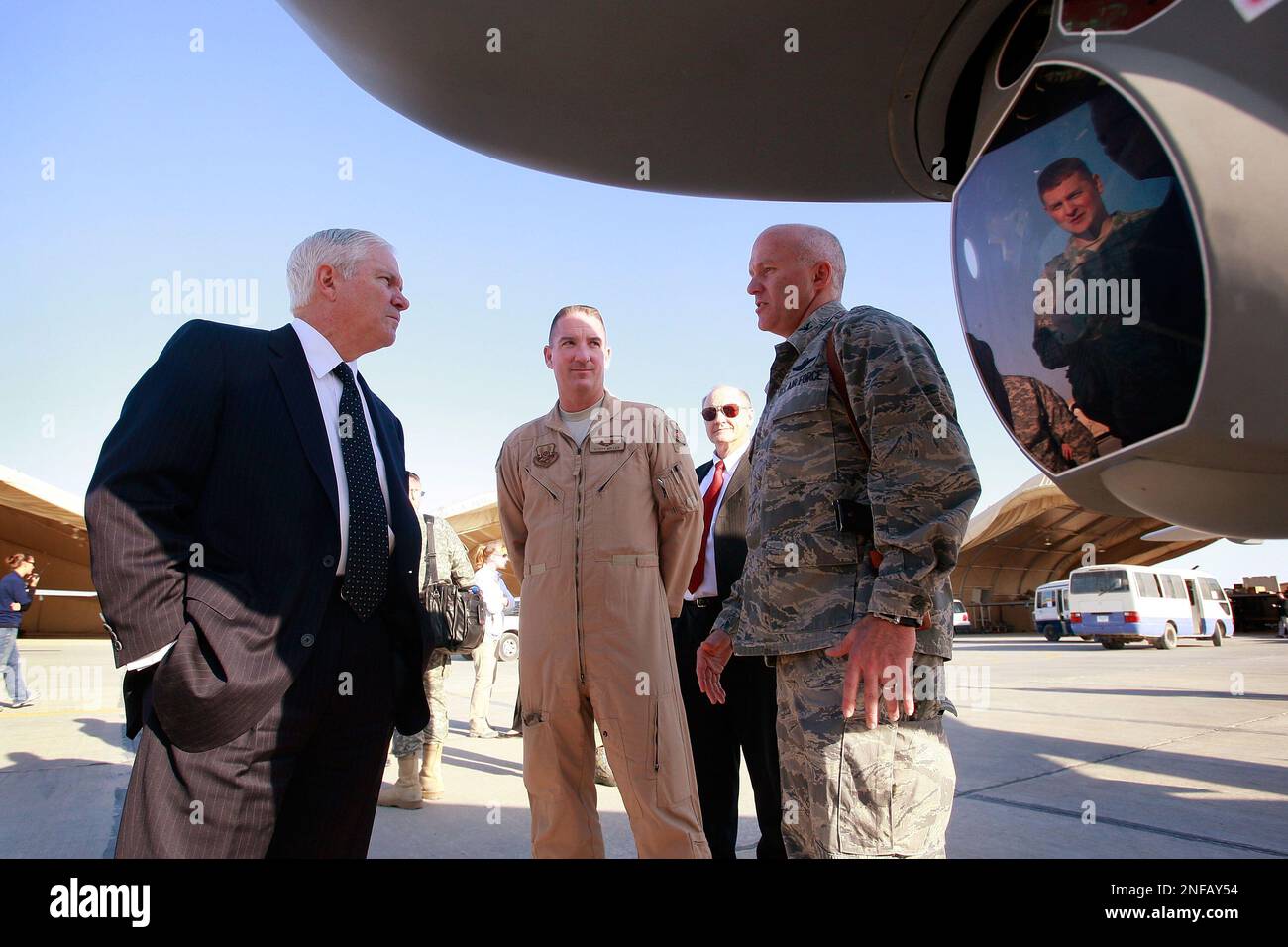 Defense Secretary Robert Gates, left, is shown an unmanned aerial ...