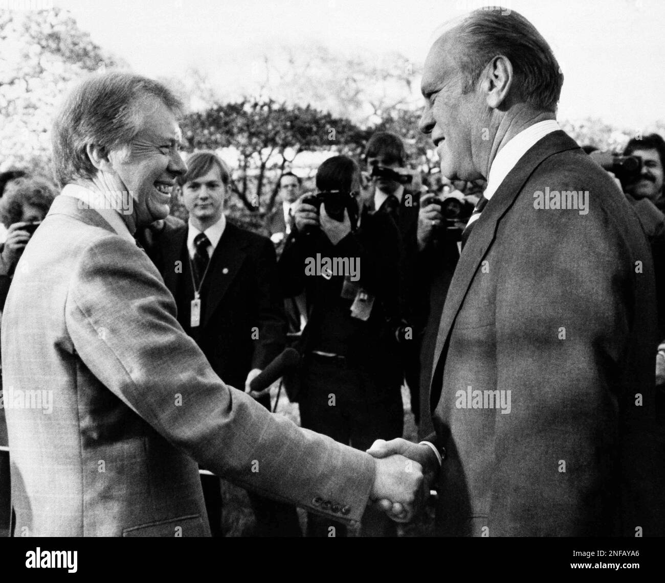 President Jimmy Carter, left, greets former President Gerald Ford as ...