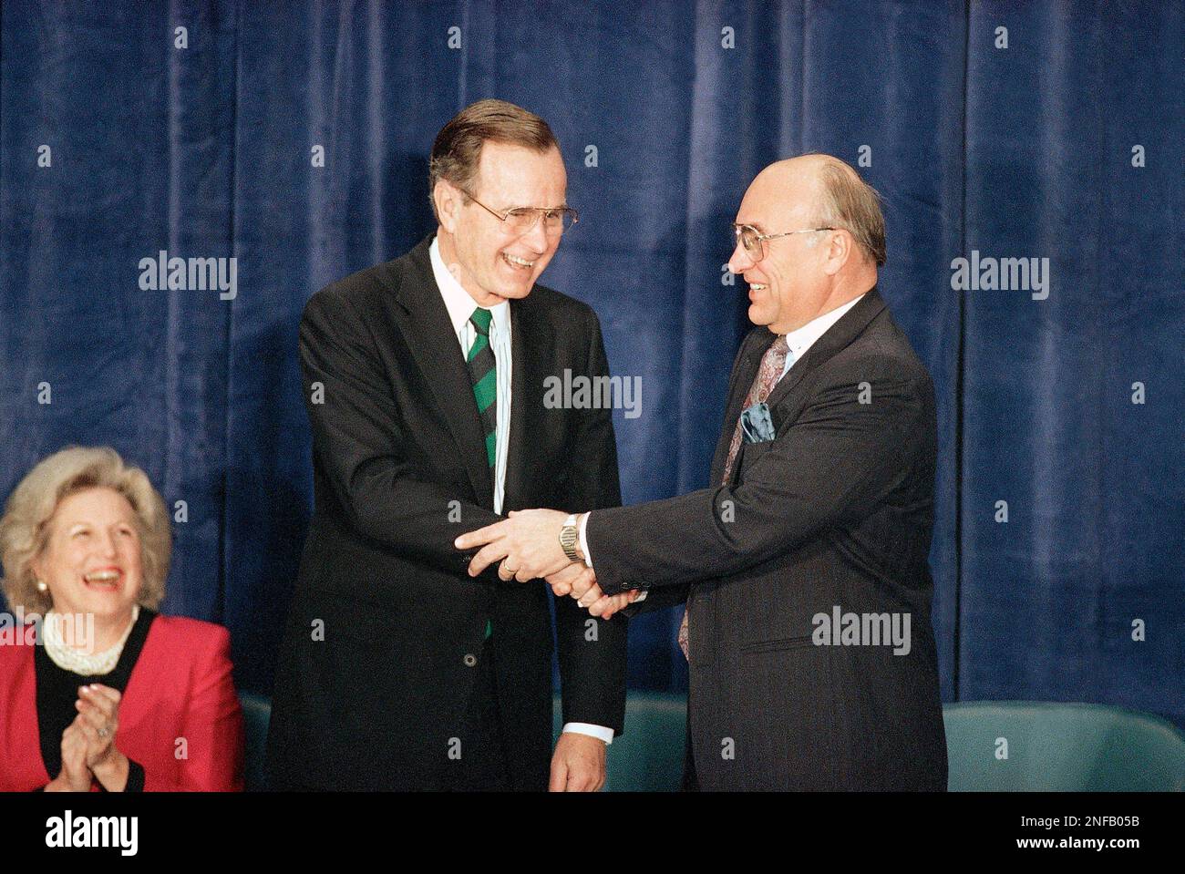President George Bush shakes hands with Clayton Yeutter in Washington ...