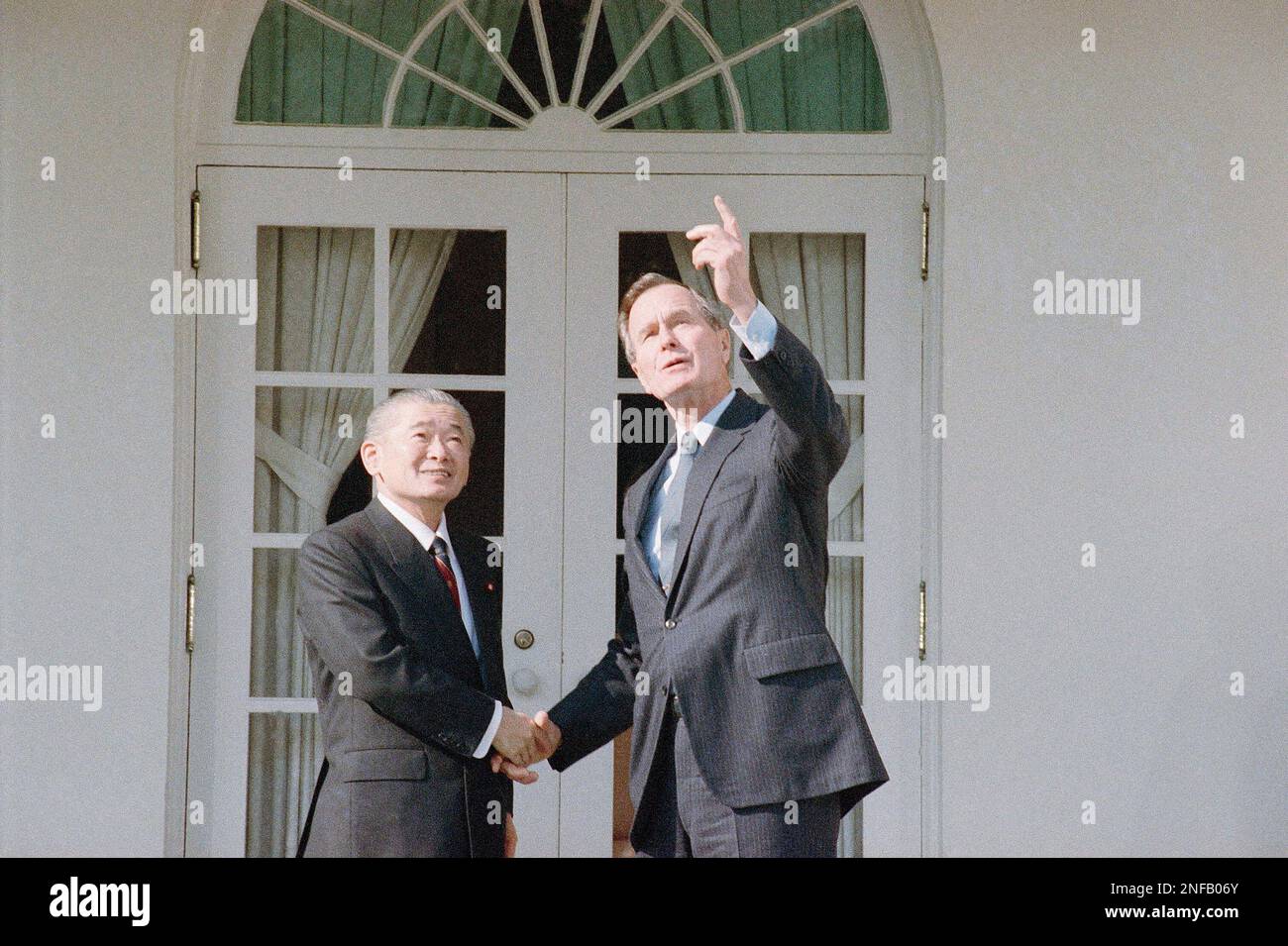 Japanese Prime Minister Noboru Takeshita is greeted by President George ...