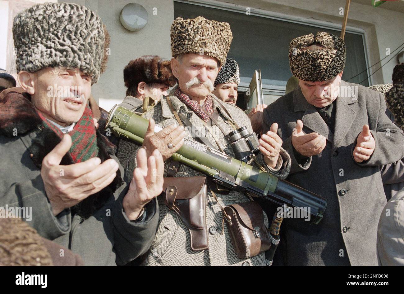 Chechen elders pray at the presidential building in Grozny, the capital ...