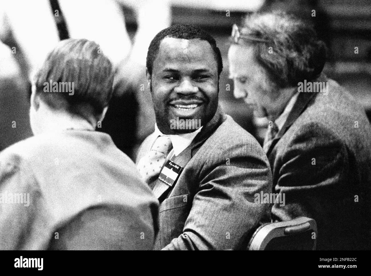 Larry Davis, center, flashes a smile as his lawyer, William Kunstler ...