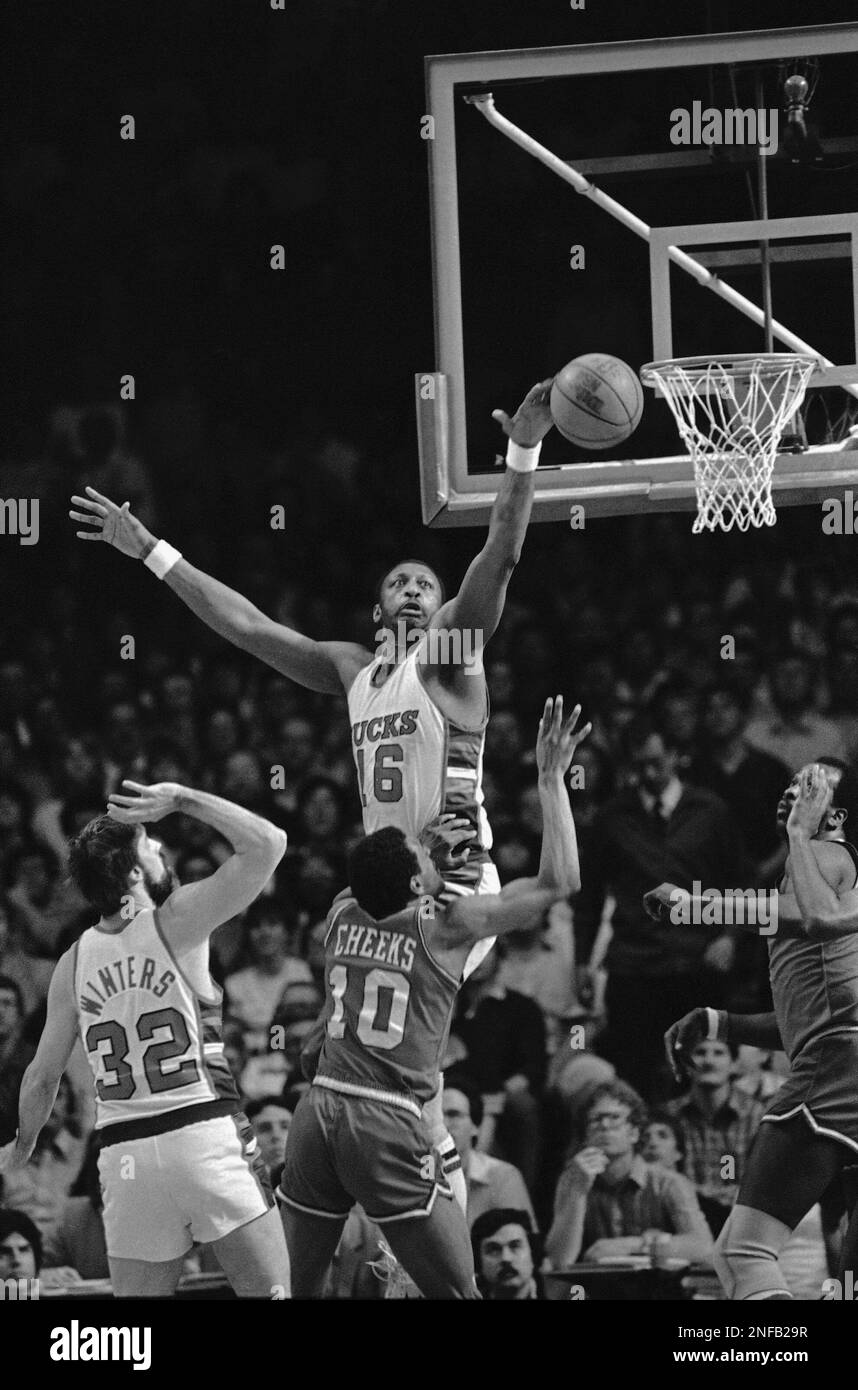 Milwaukee's Bob Lanier (16) goes high to block a shot by Philadelphia's ...