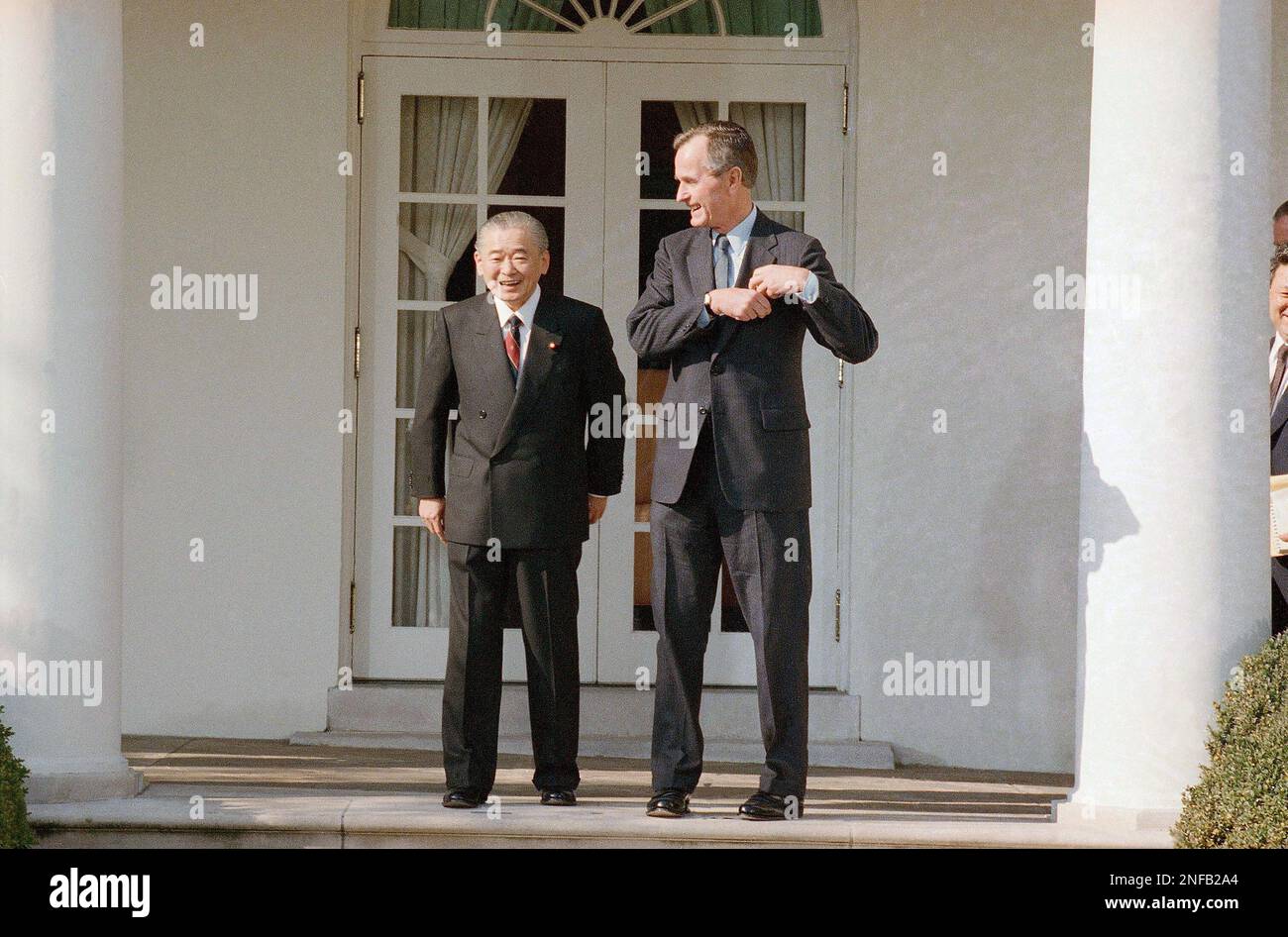 Japanese Prime Minister Noboru Takeshita and President George Bush take ...