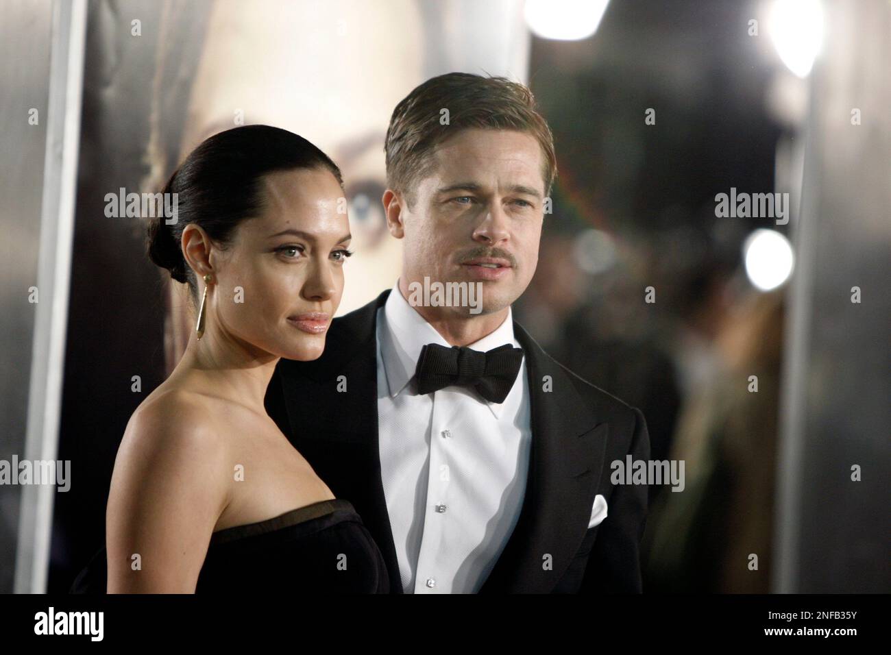 Brad Pitt, right, and Angelina Jolie arrive at the premiere of "The ...