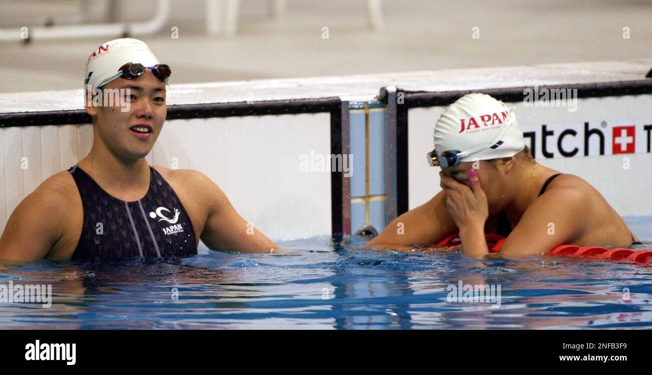 Japanese swimmer Mai Nakamura, right, reacts to winning the silver ...