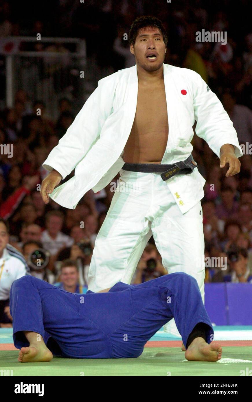 Japan's Shinichi Shinohara stands up after pinning down his opponent ...